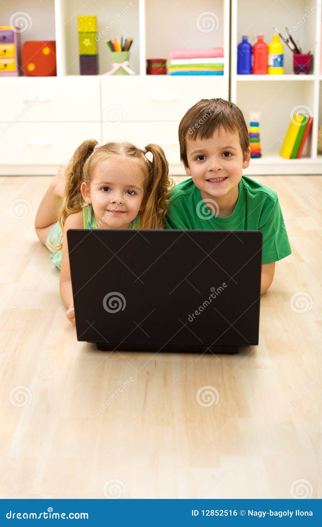 Kids with Laptop Laying on the Floor at Home Stock Photo - Image of ...