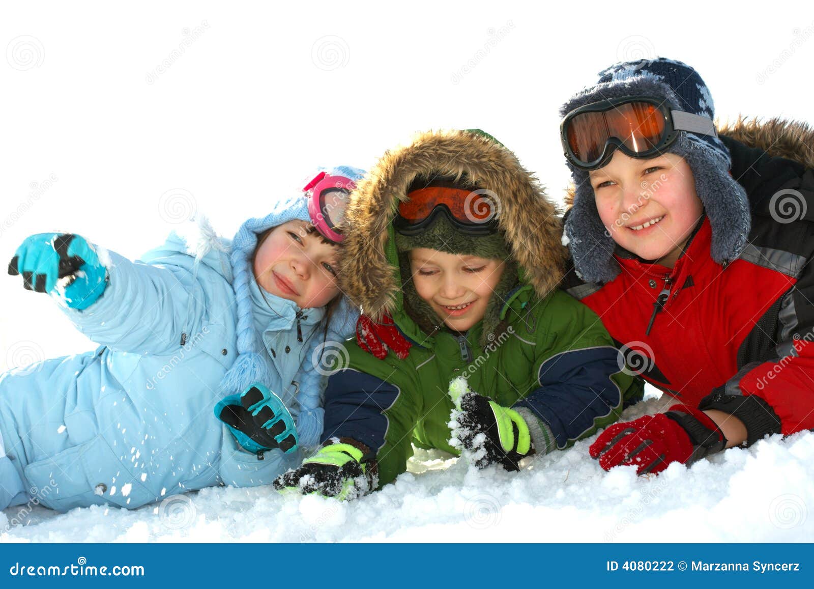 Kids laying in winter snow stock photo. Image of laying - 4080222