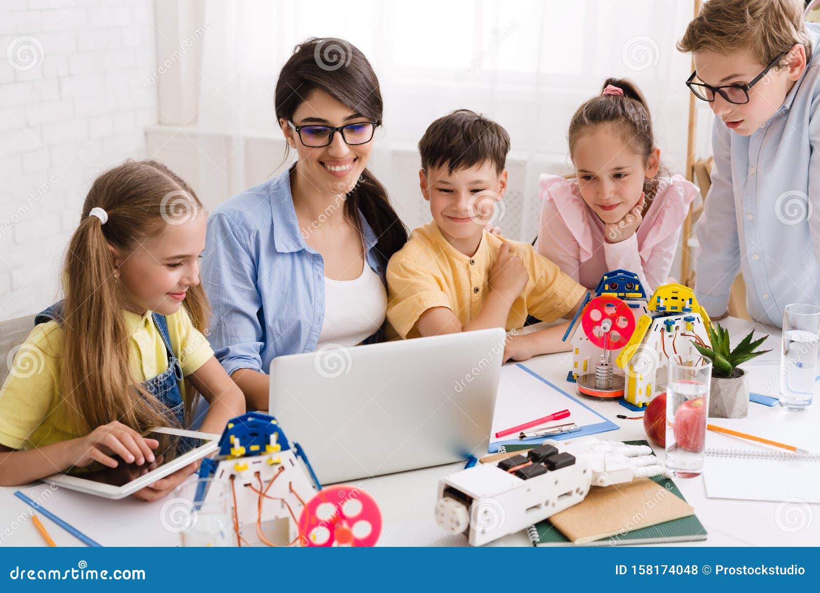 Kids Learning about Computers and Robots with Their Teacher Stock Photo ...