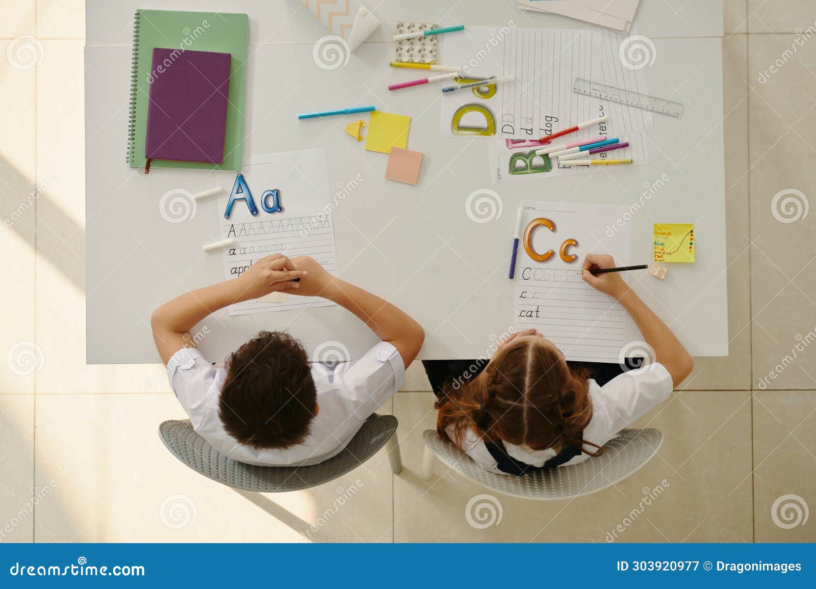 Kids Learning Writing Letters Stock Image - Image of classmates, school ...