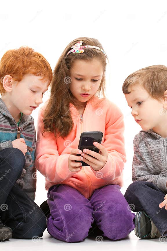 Kids looking at smartphone stock photo. Image of communication - 31464162