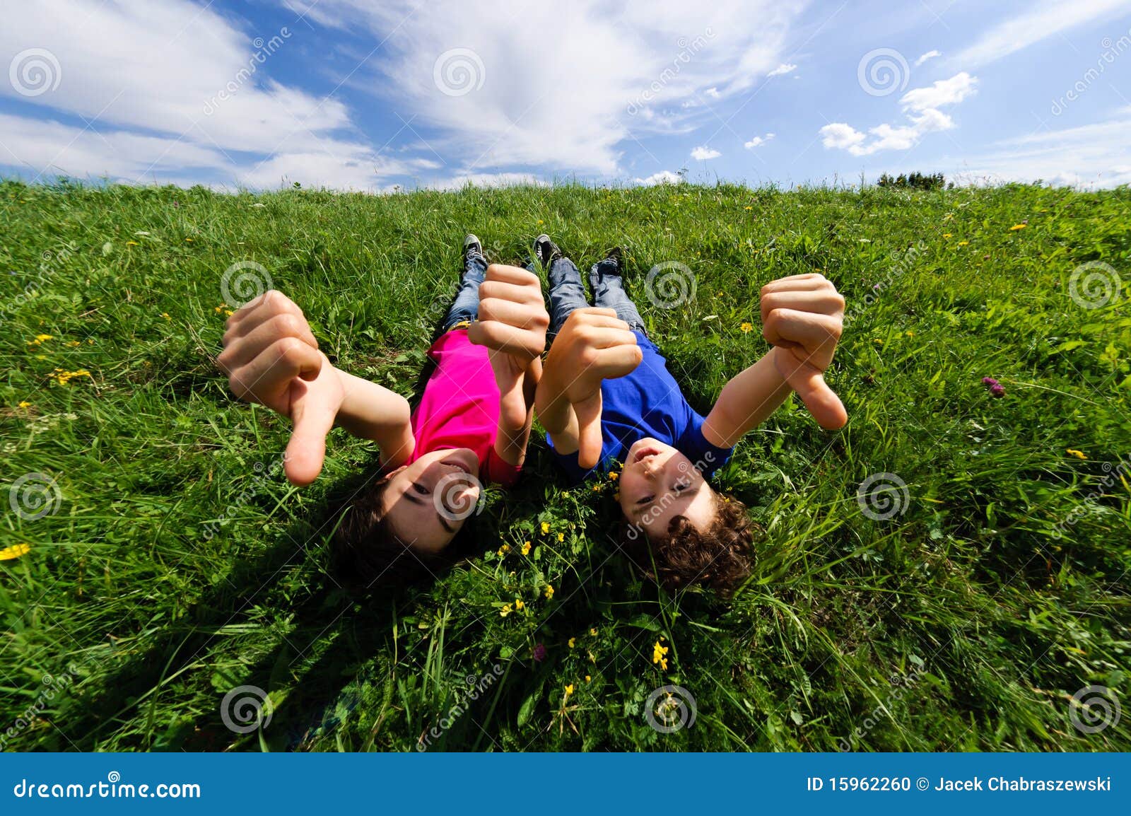 Kids lying outdoor stock photo. Image of beautiful, clouds - 15962260