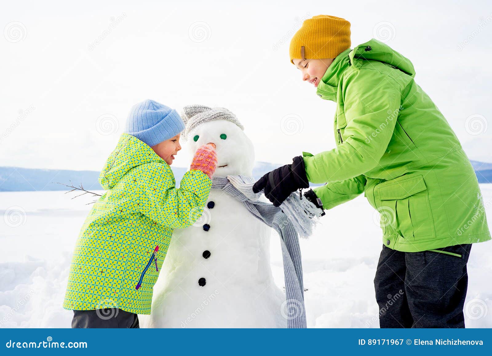 Kids making a snowman stock image. Image of people, snowballs - 89171967