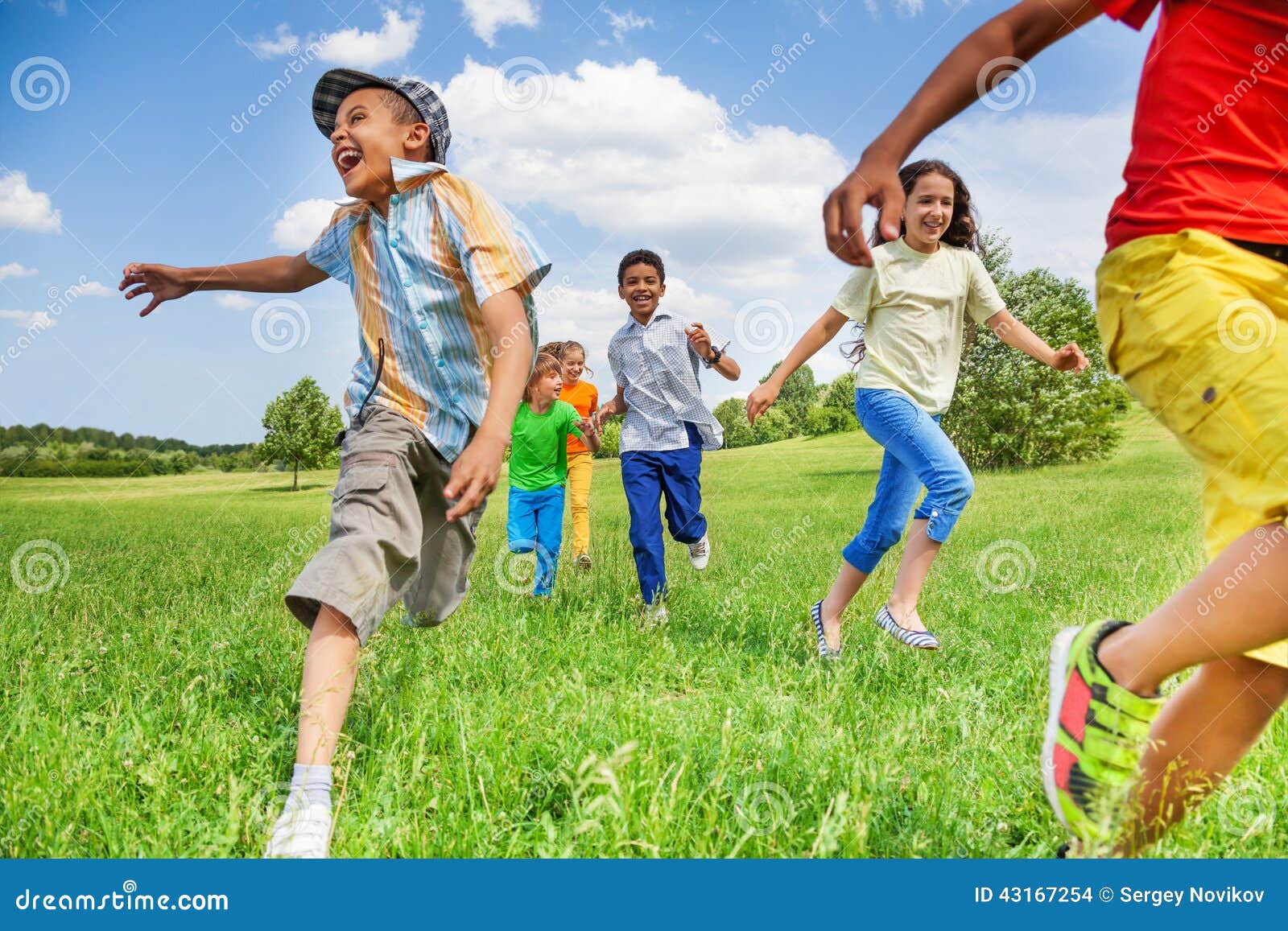 Kids in Motion of Running on Green Field Stock Photo - Image of bright ...