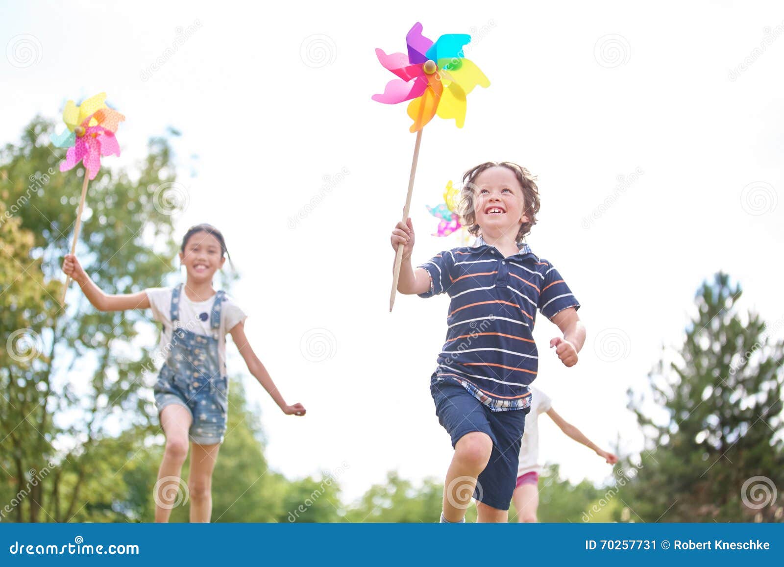 Kids with pinwheels stock image. Image of childhood, child - 70257731