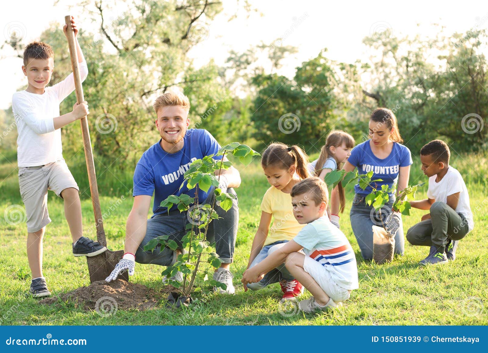 Kids Planting Trees with Volunteers Stock Image - Image of kids ...