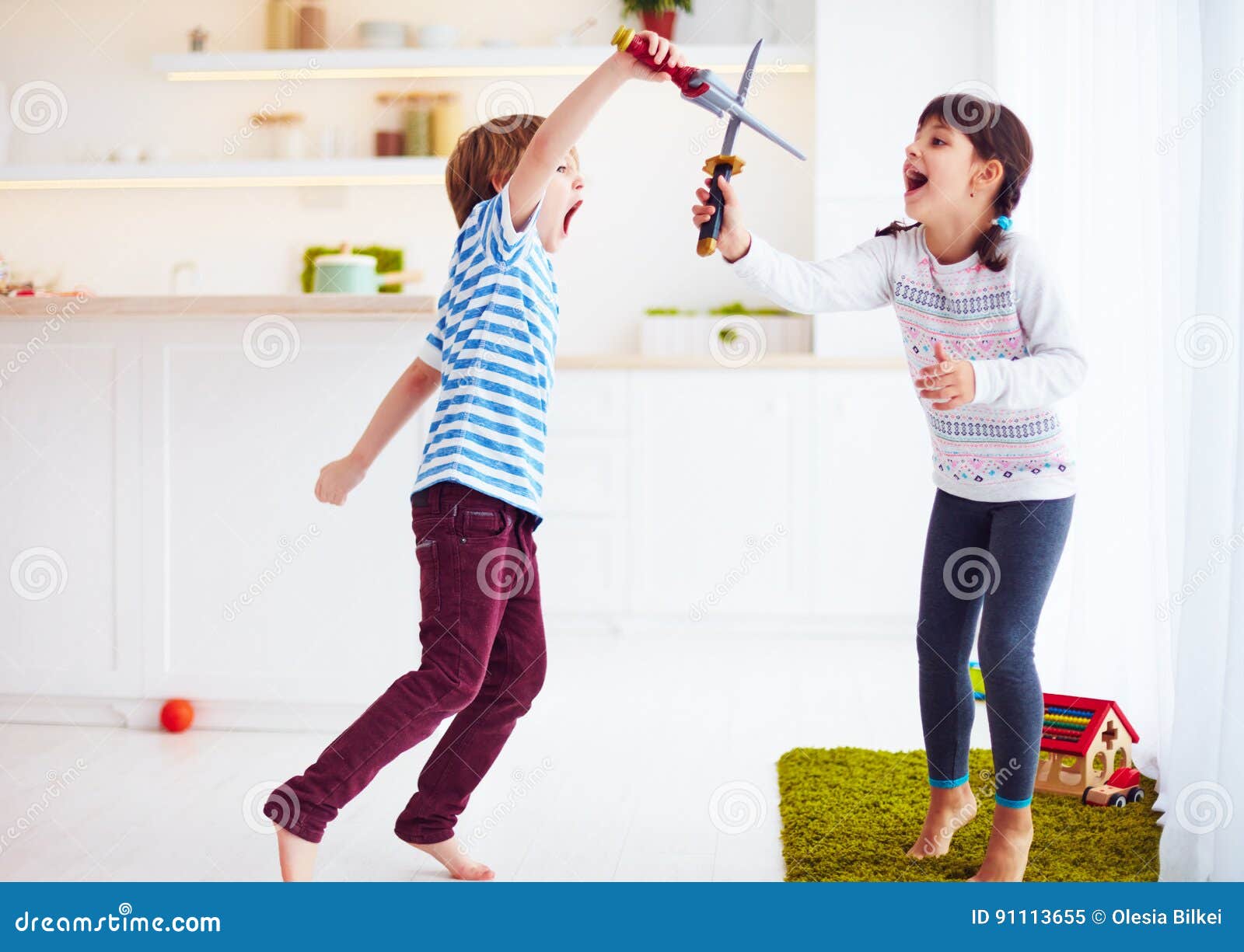 Kids Playing Active Fight Games at Home Kitchen Stock Image - Image of ...
