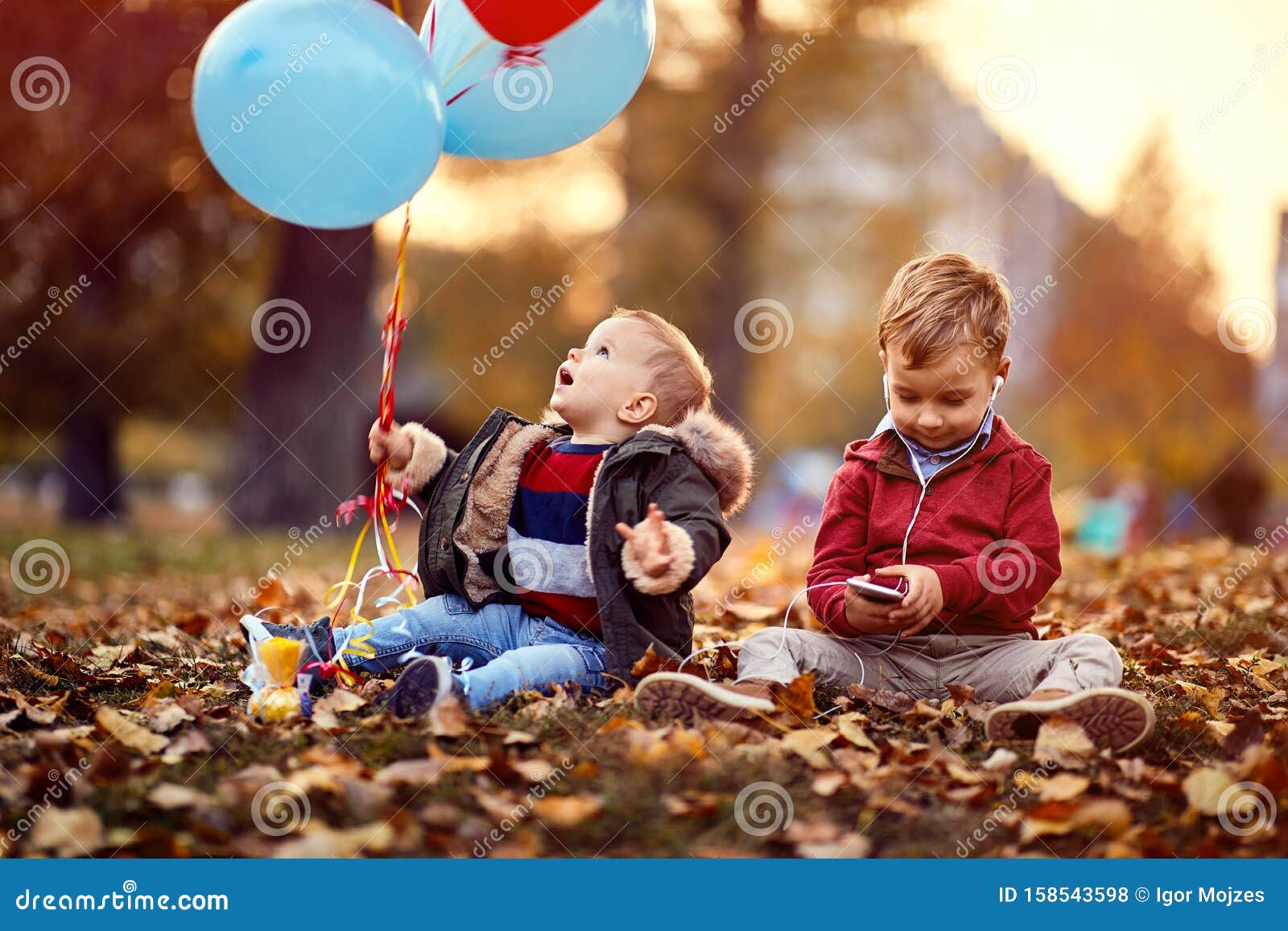 Kids Playing with Balloons and Smartphone Outdoors Stock Photo - Image ...