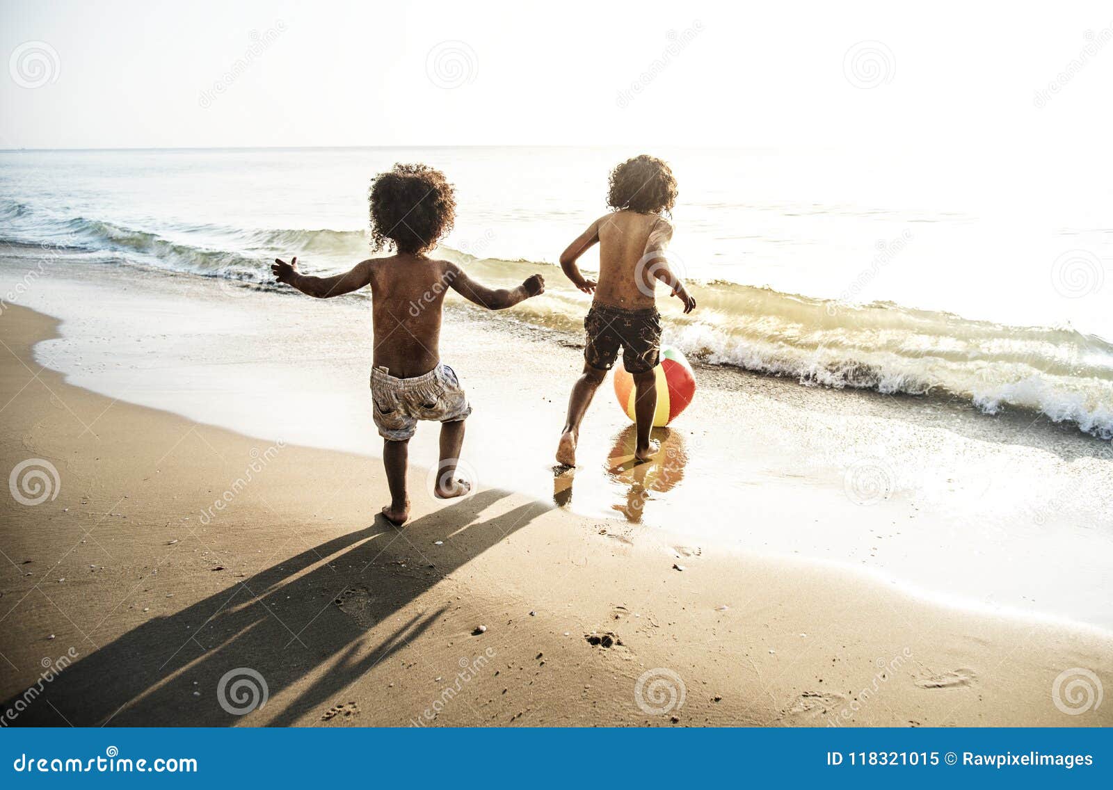Kids playing at the beach stock image. Image of afro - 118321015