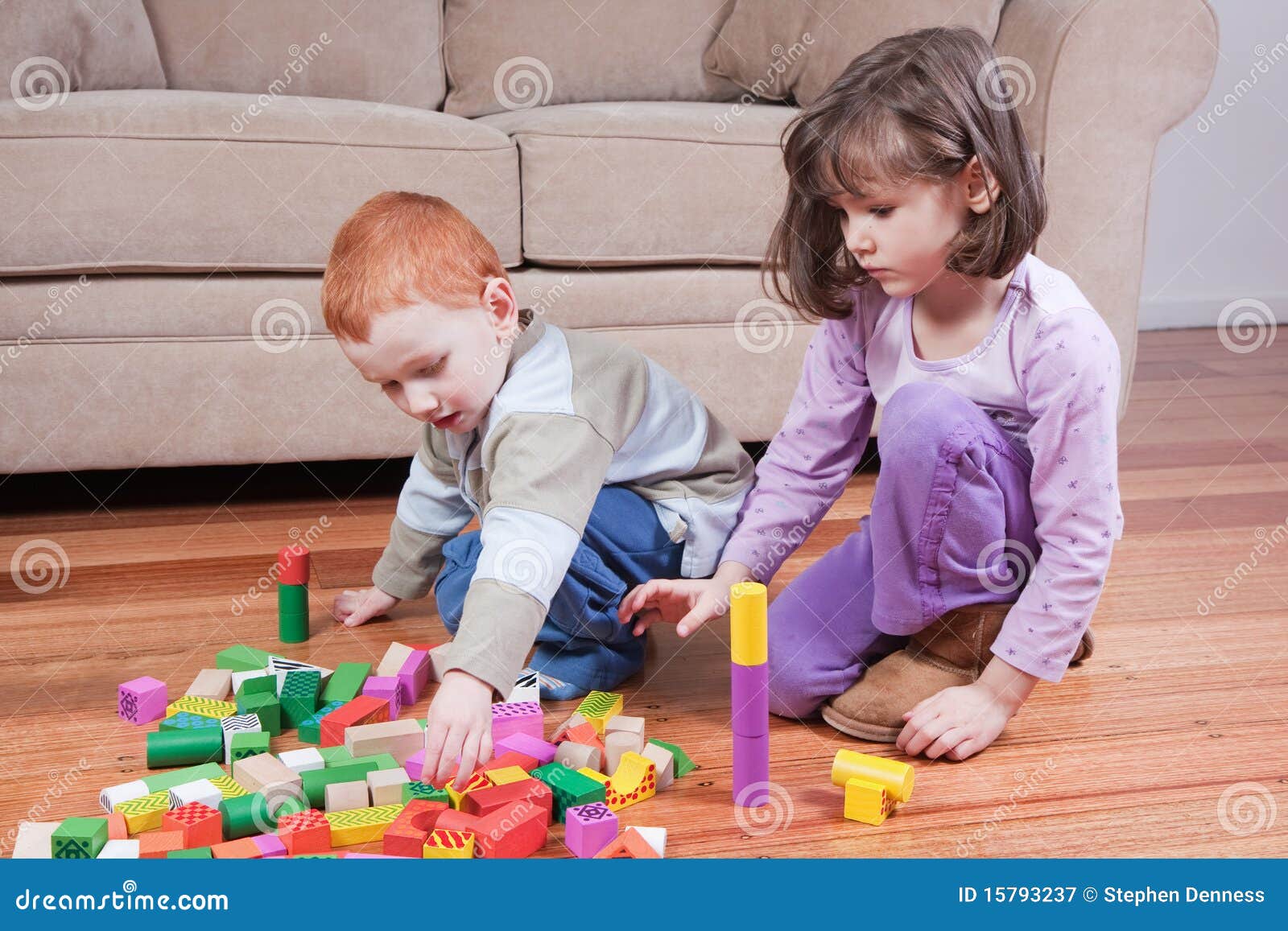 Kids playing with blocks stock image. Image of floorboards - 15793237