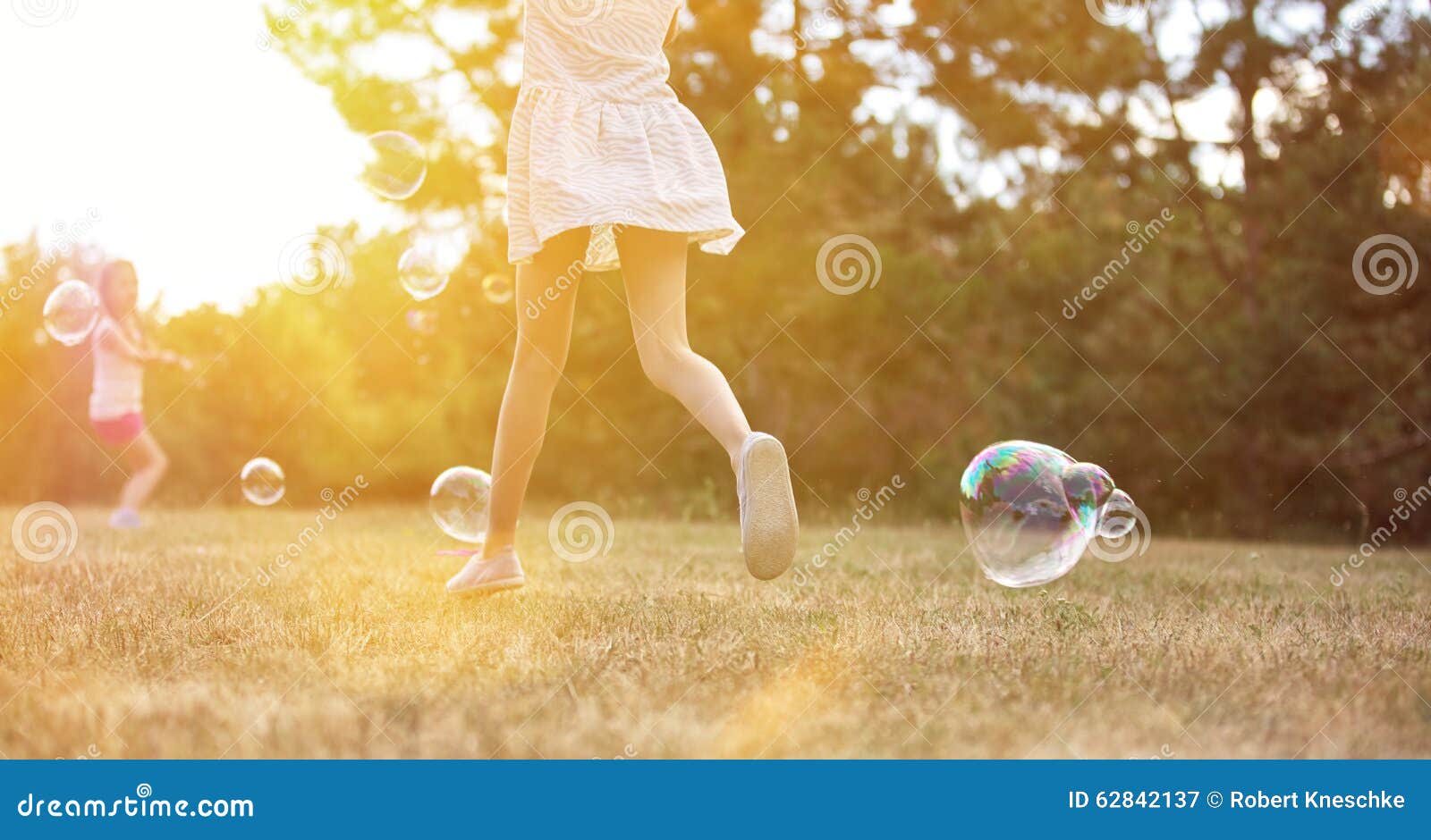 Kids playing with bubbles stock image. Image of nature - 62842137