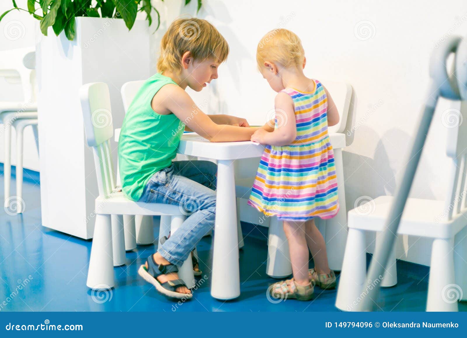 Kids Playing and Drawing in Kids Table, Activity Corner Stock Photo ...