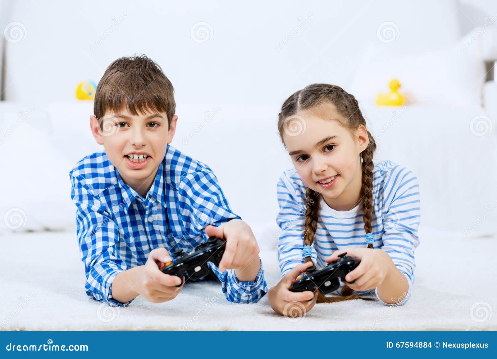 Kids playing game console stock photo. Image of interest - 67594884