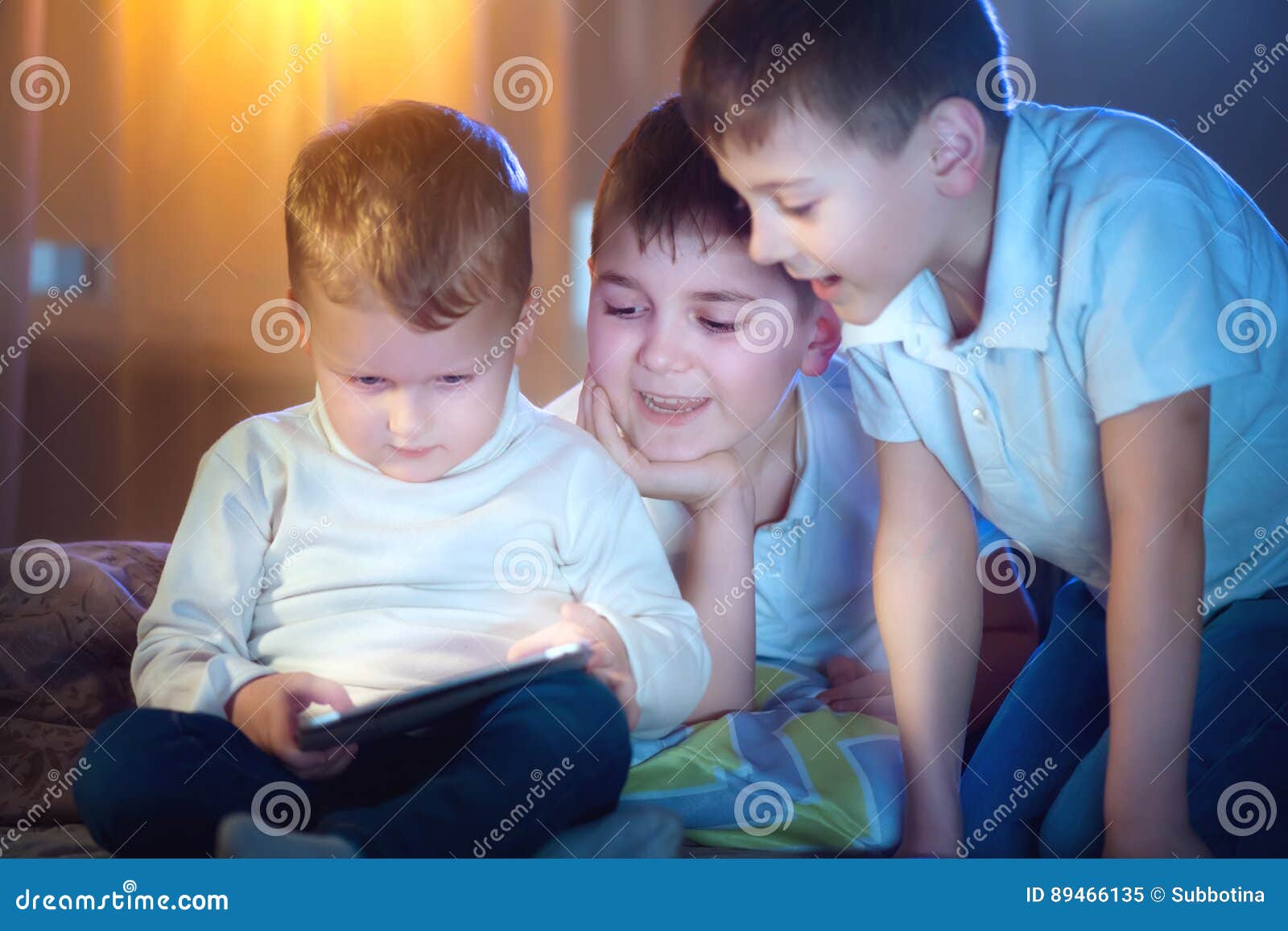 Kids Playing Games on Tablet Pc. Three Little Boys with Tablet Computer ...