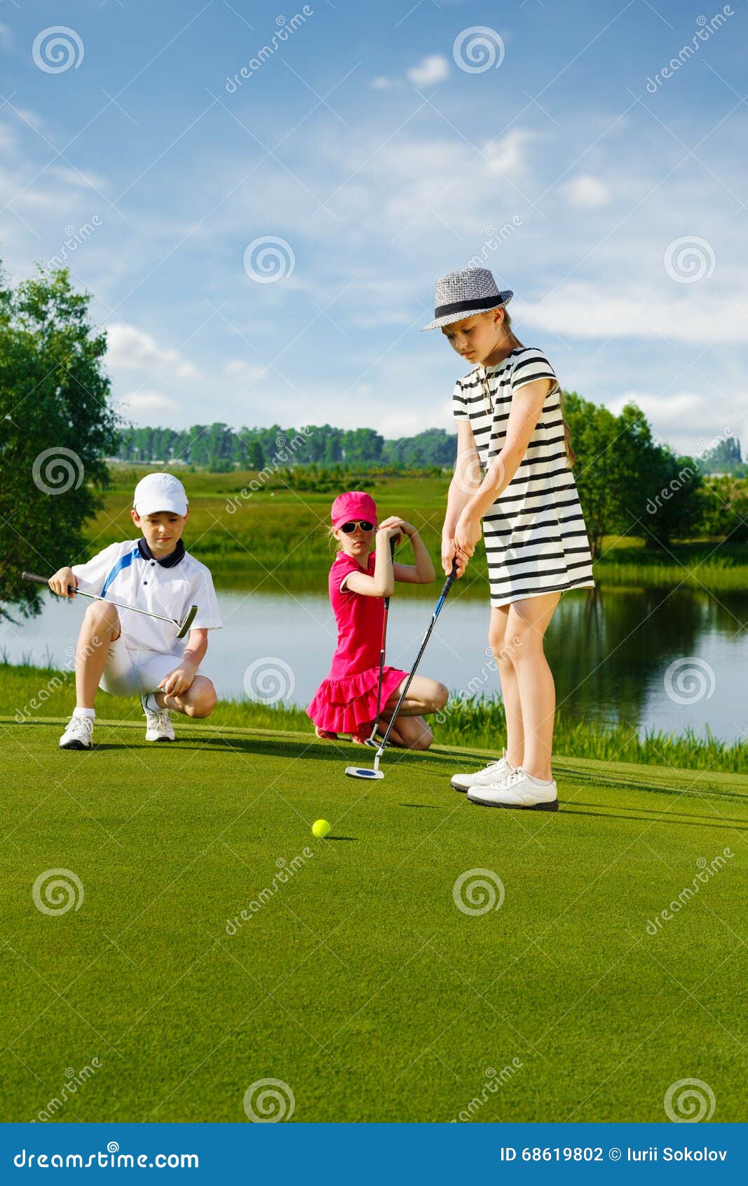 Kids playing golf stock photo. Image of girl, childhood - 68619802