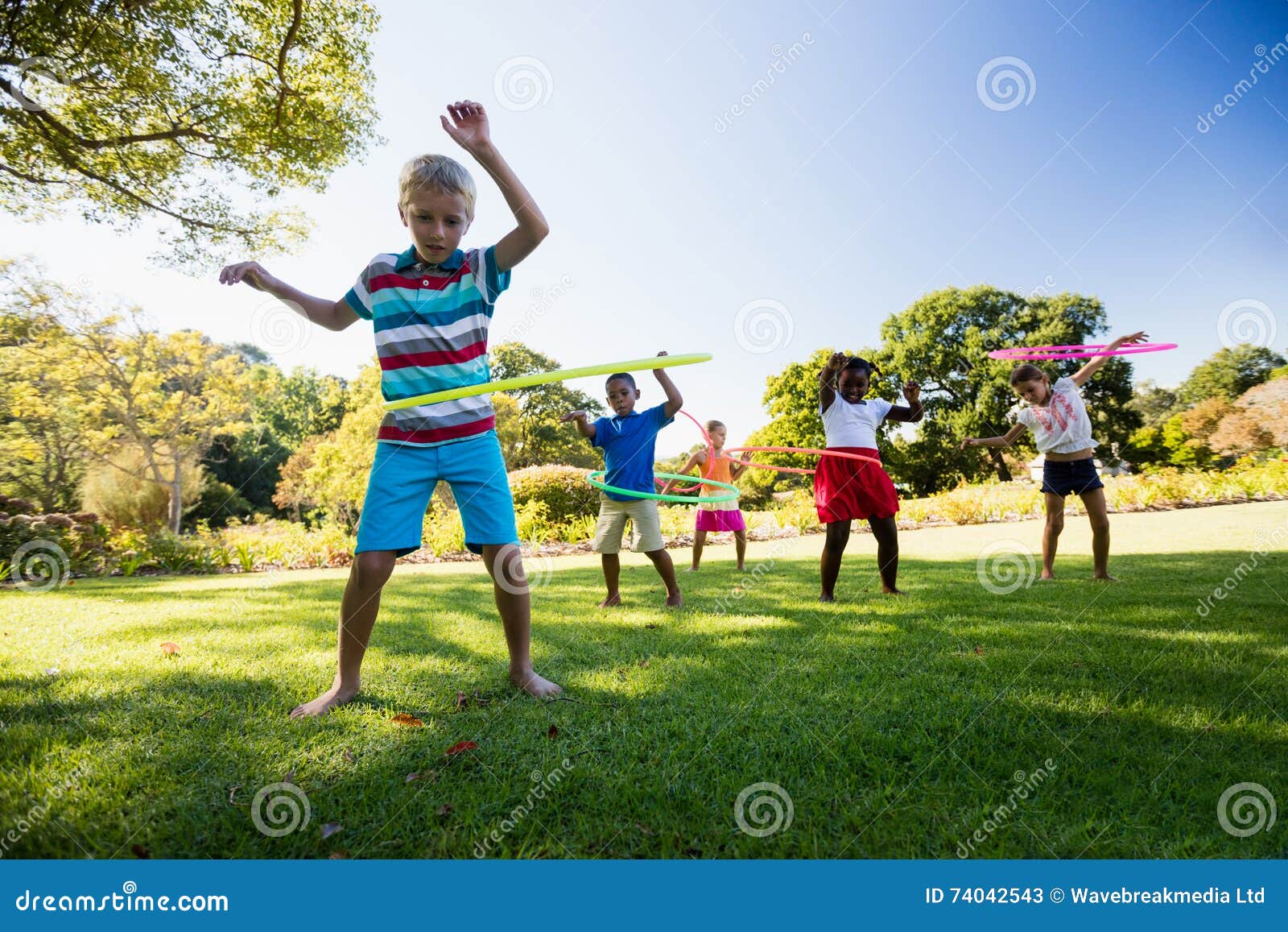 Kids Playing Hoop Together during a Sunny Day Stock Image - Image of ...