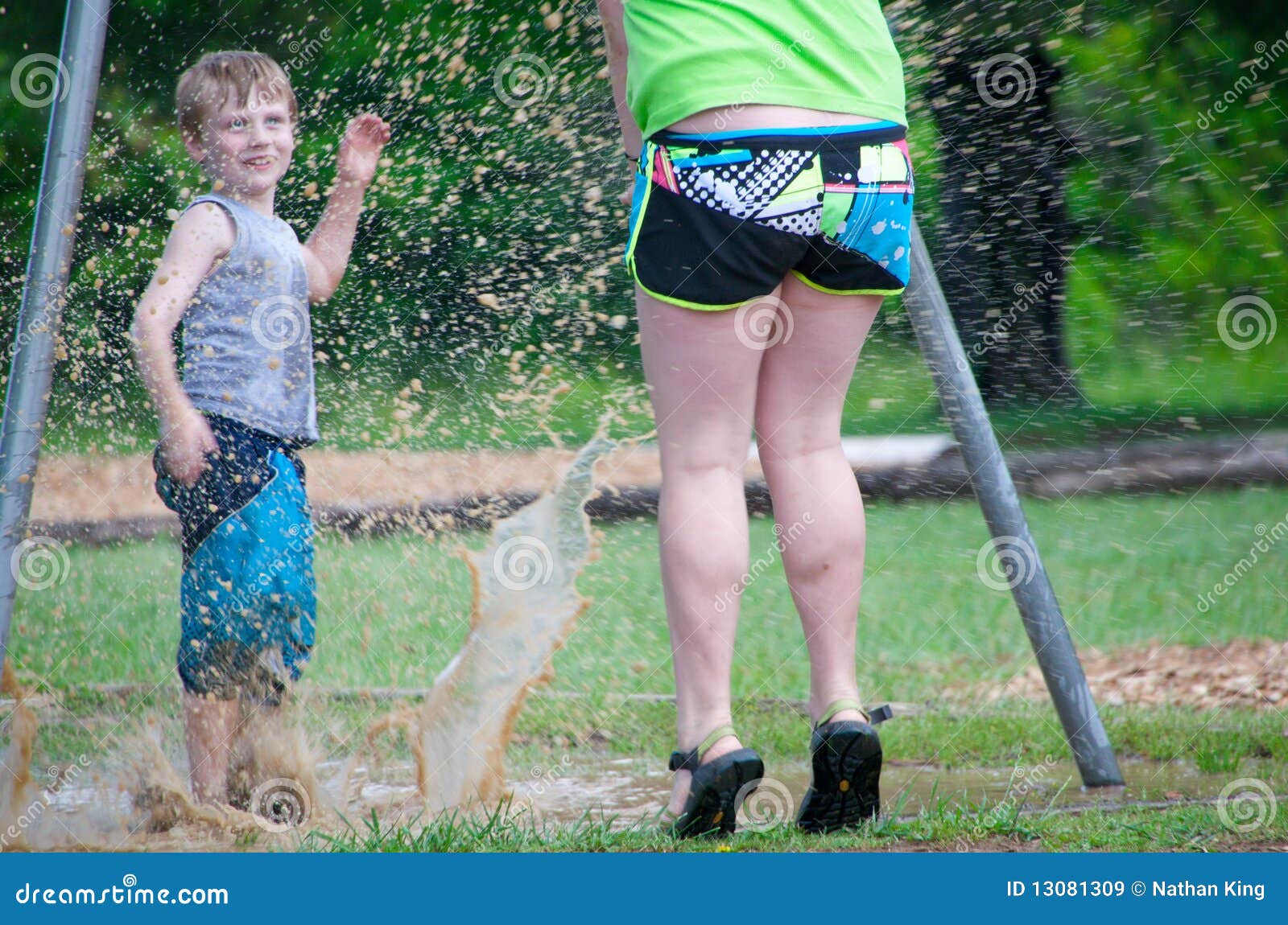 Kids Playing in Mud stock image. Image of kick, mess - 13081309