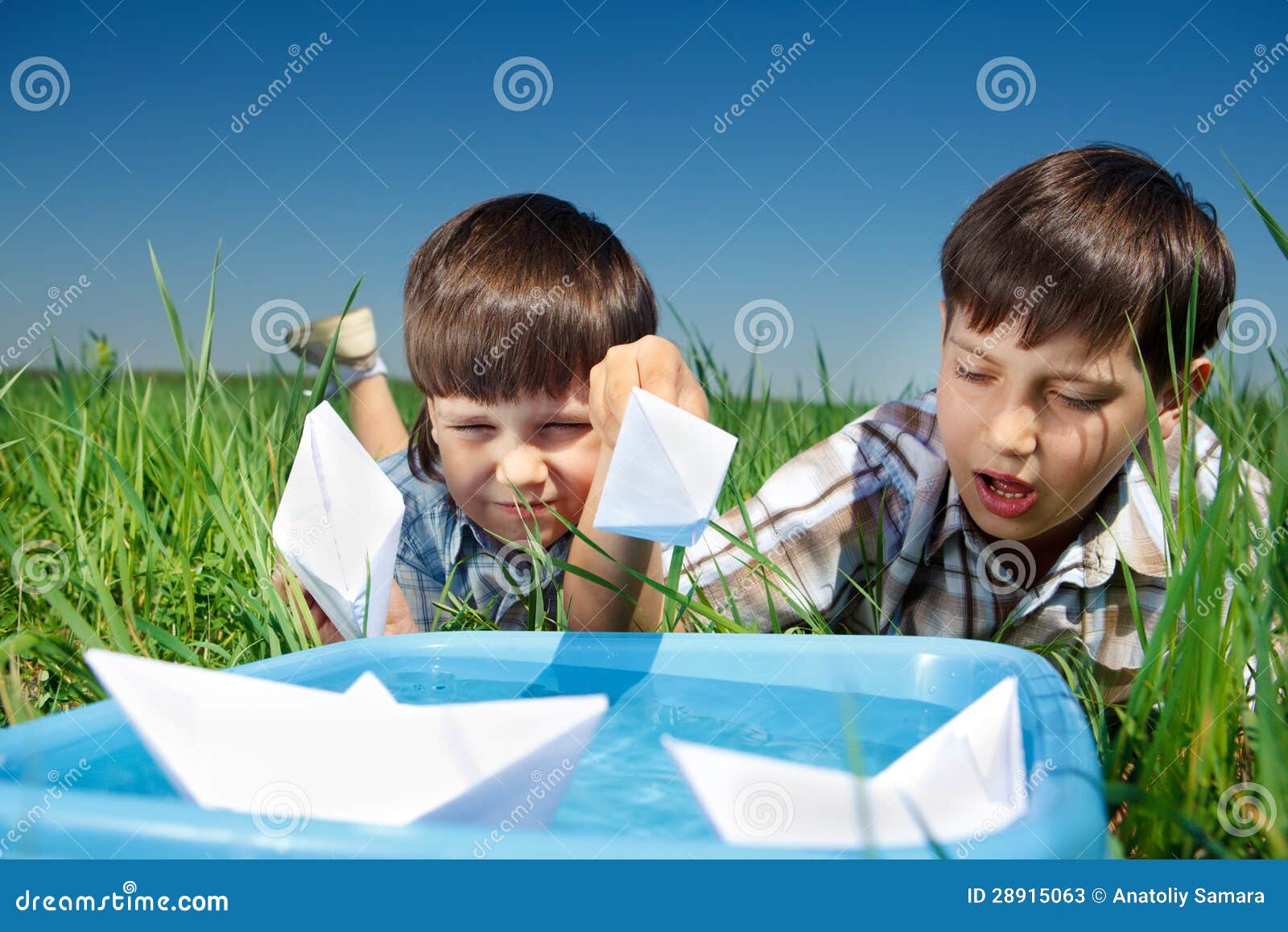 Kids Playing with Paper Boats Stock Image - Image of happy, basin: 28915063