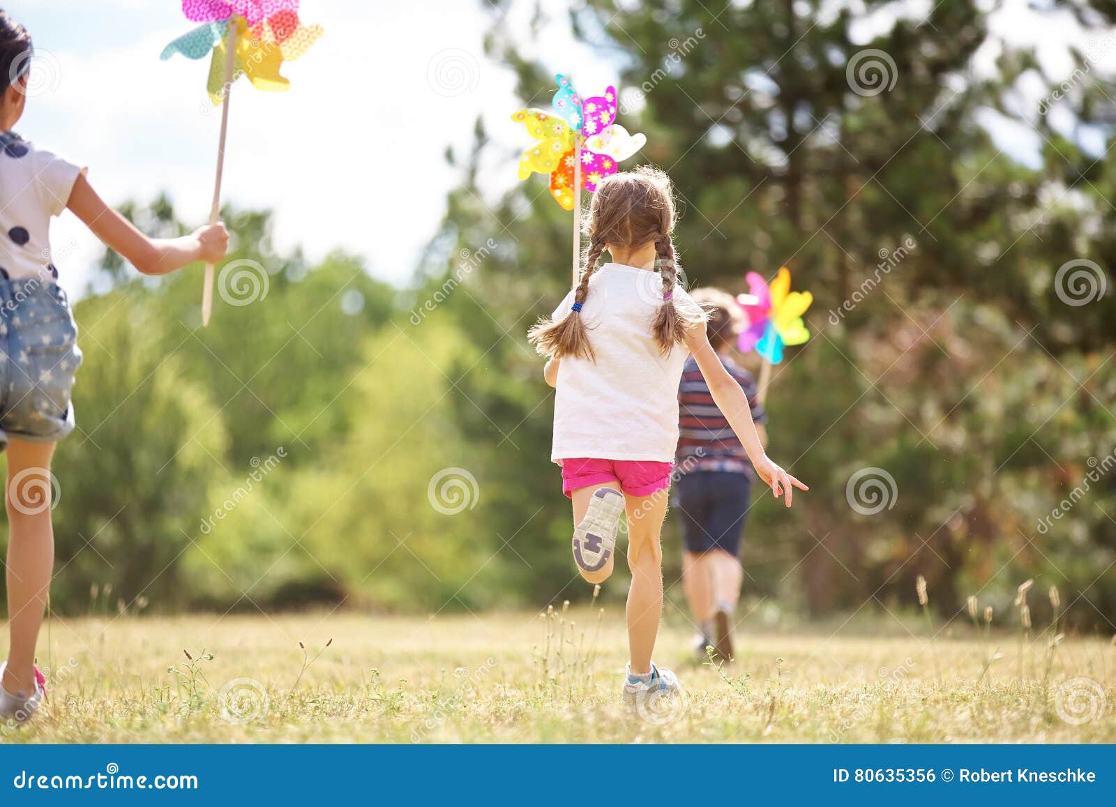 Kids Playing with Pinwheels Stock Photo - Image of fall, girl: 80635356