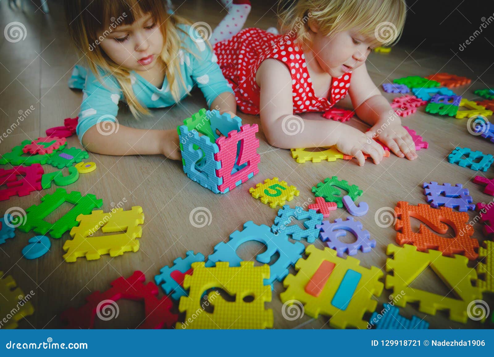 Kids Playing with Puzzle, Learning Shapes and Numbers Stock Image ...
