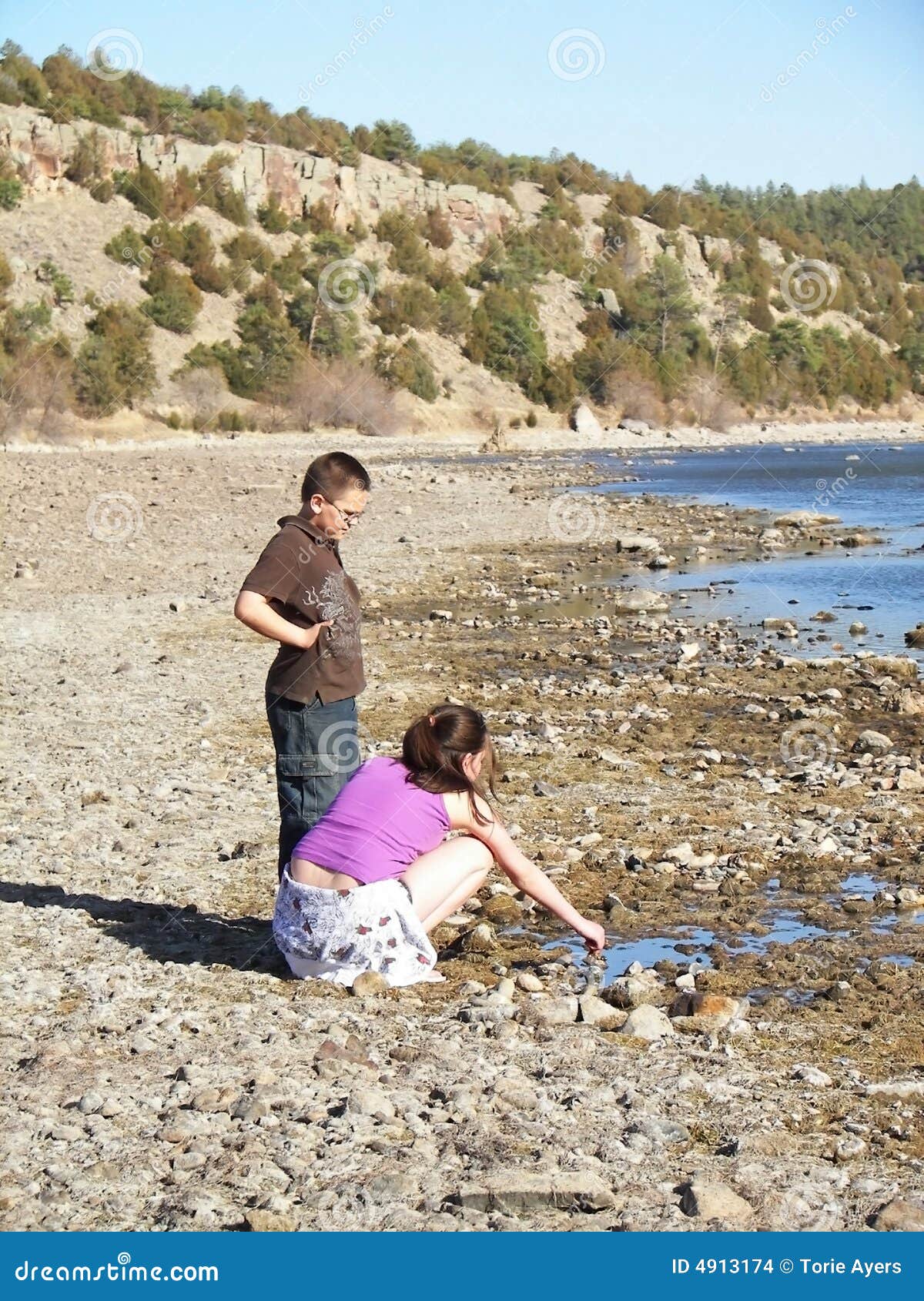 Kids playing by a river stock photo. Image of creek, rocks - 4913174