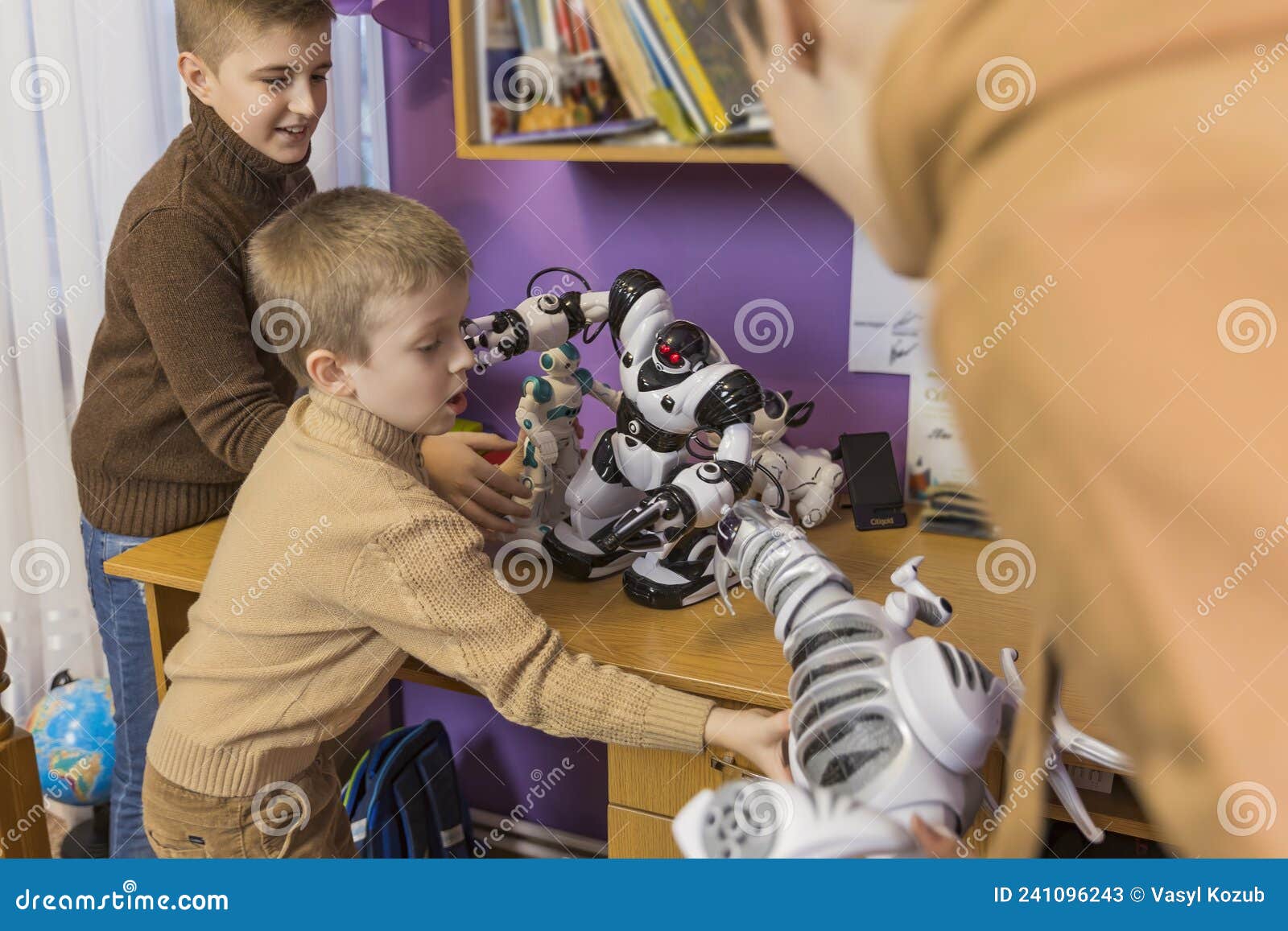 Kids playing with robots stock image. Image of childhood - 241096243