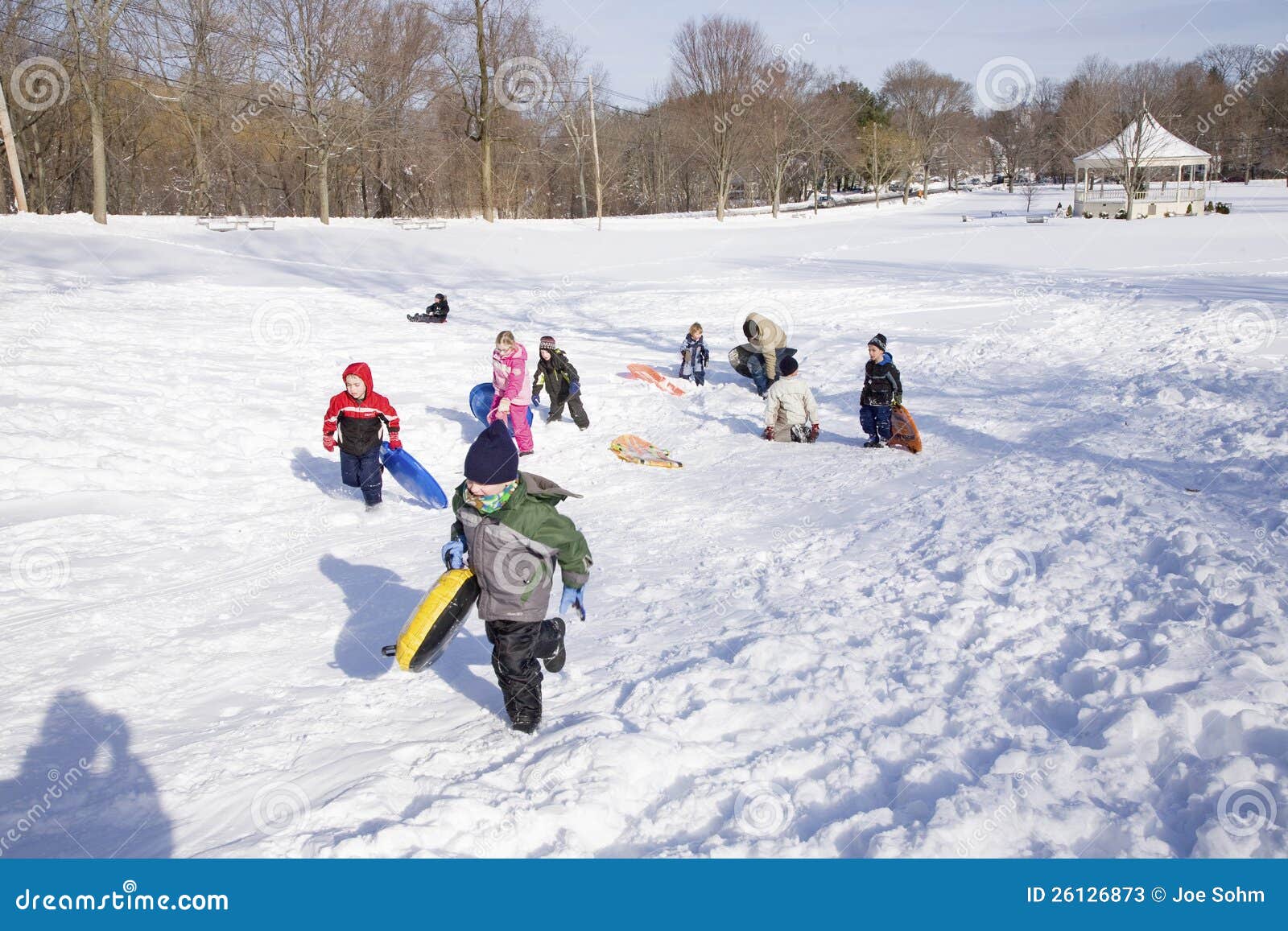 Kids playing in snow editorial stock photo. Image of ride - 26126873