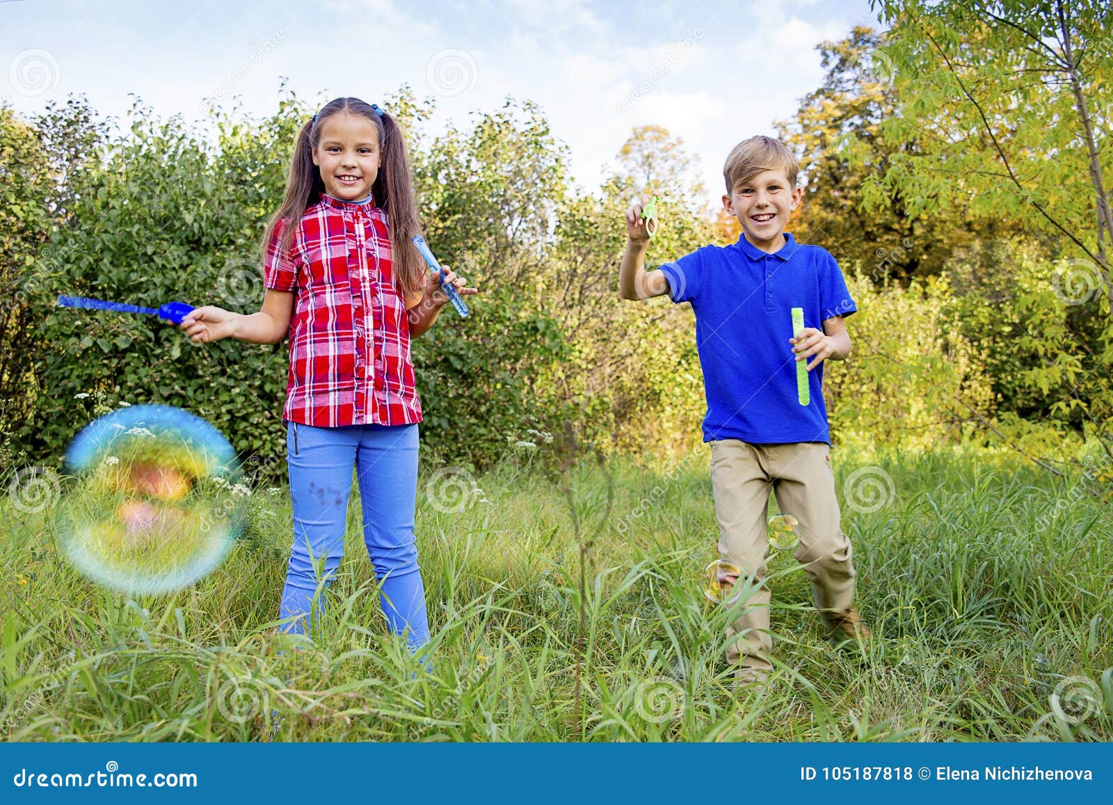 Kids playing with bubbles stock photo. Image of spring - 105187818