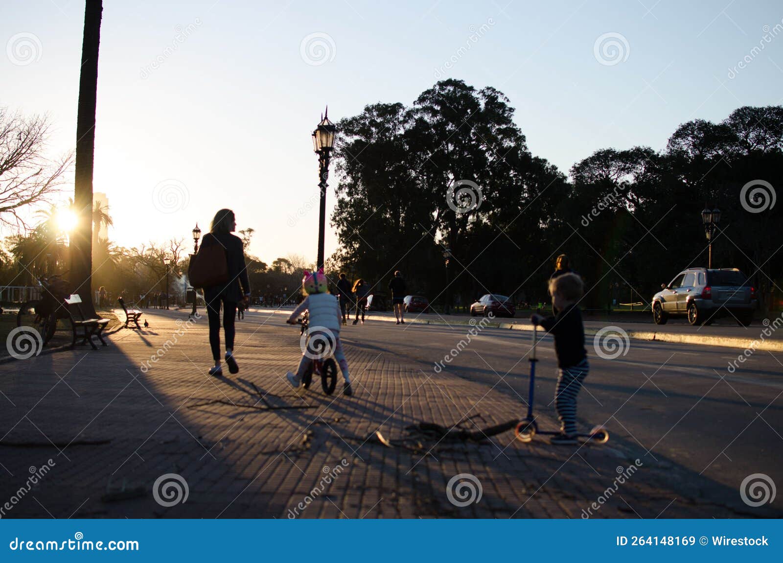 Kids Playing in the Street at Sunset Editorial Stock Image - Image of ...