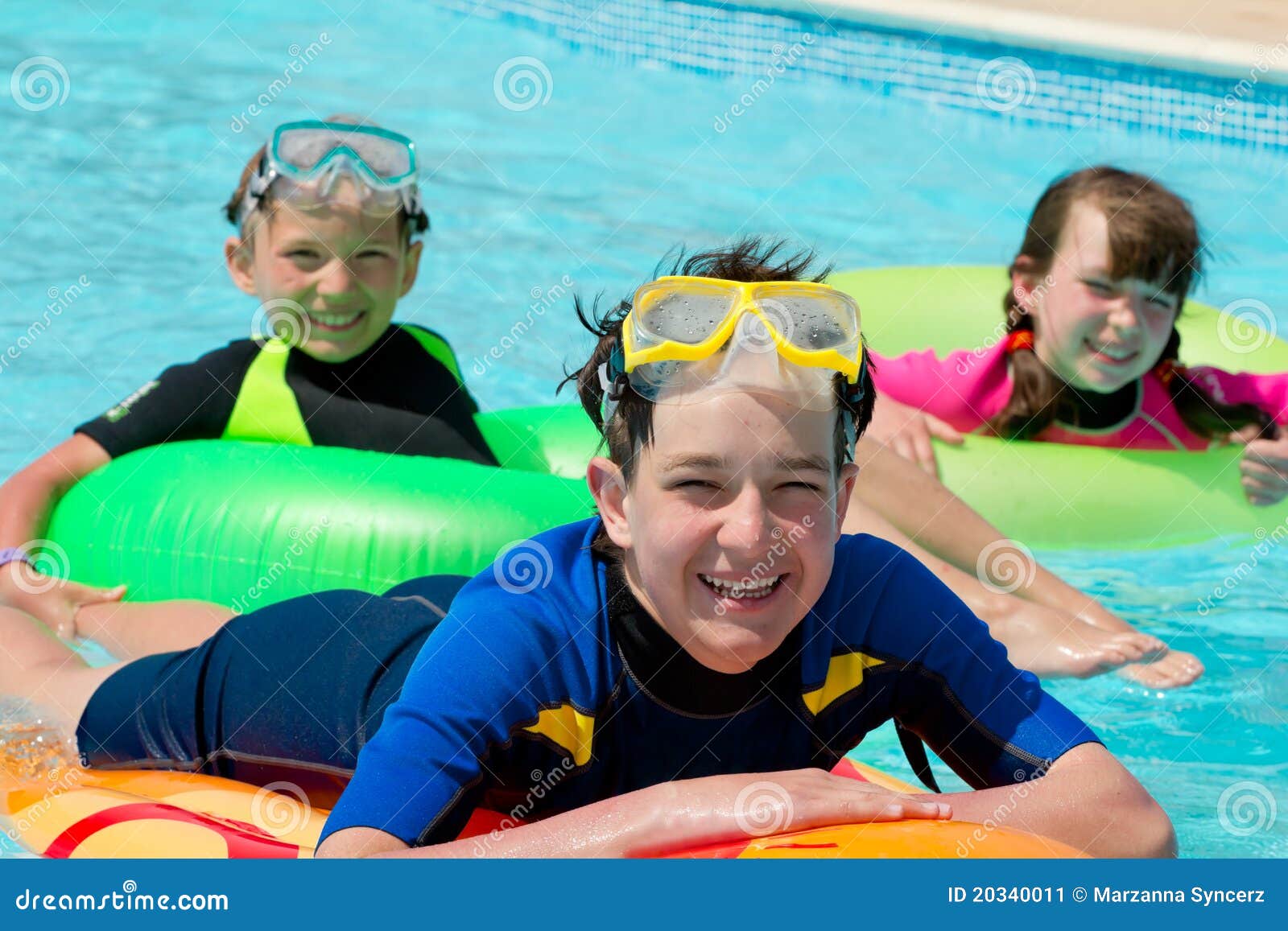 Kids Playing In Swimming Pool Stock Image - Image: 20340011