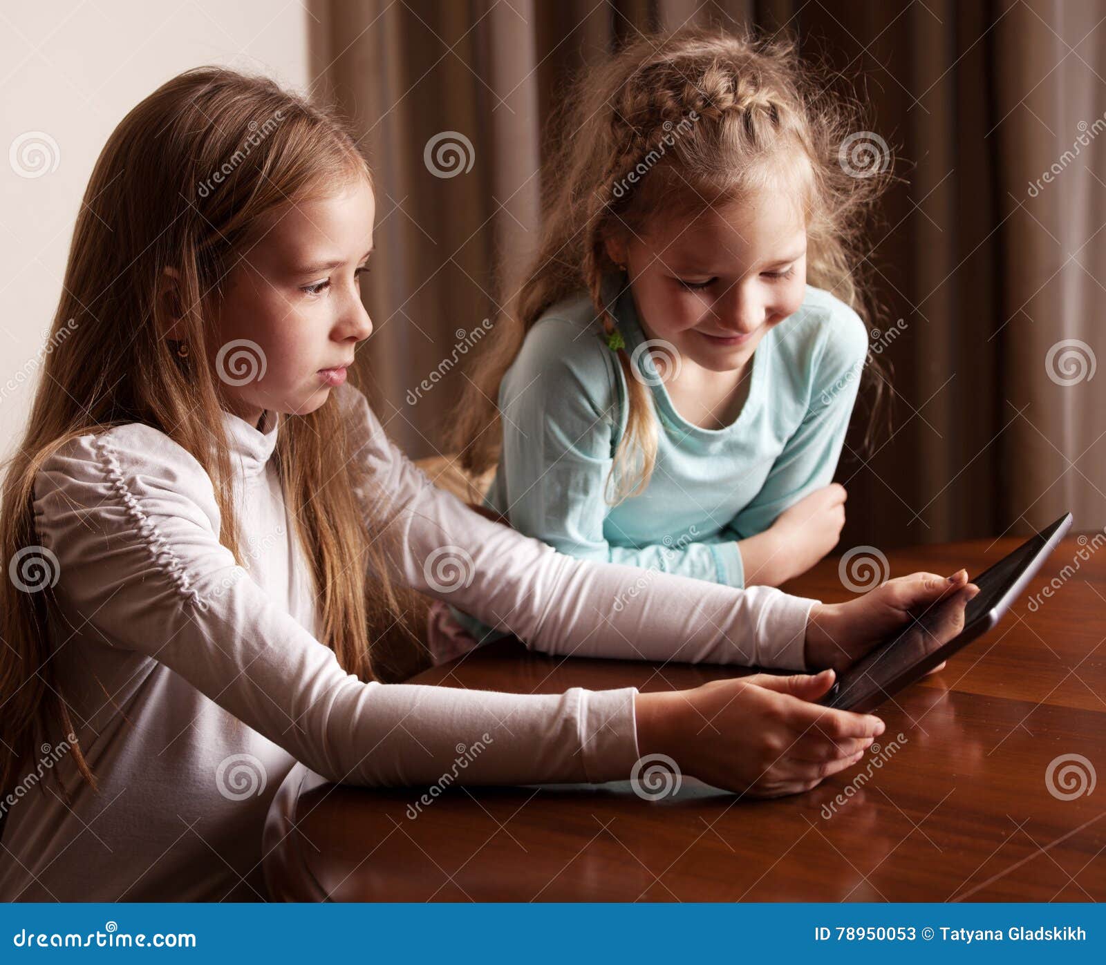 Kids playing on tablet stock image. Image of looking - 78950053
