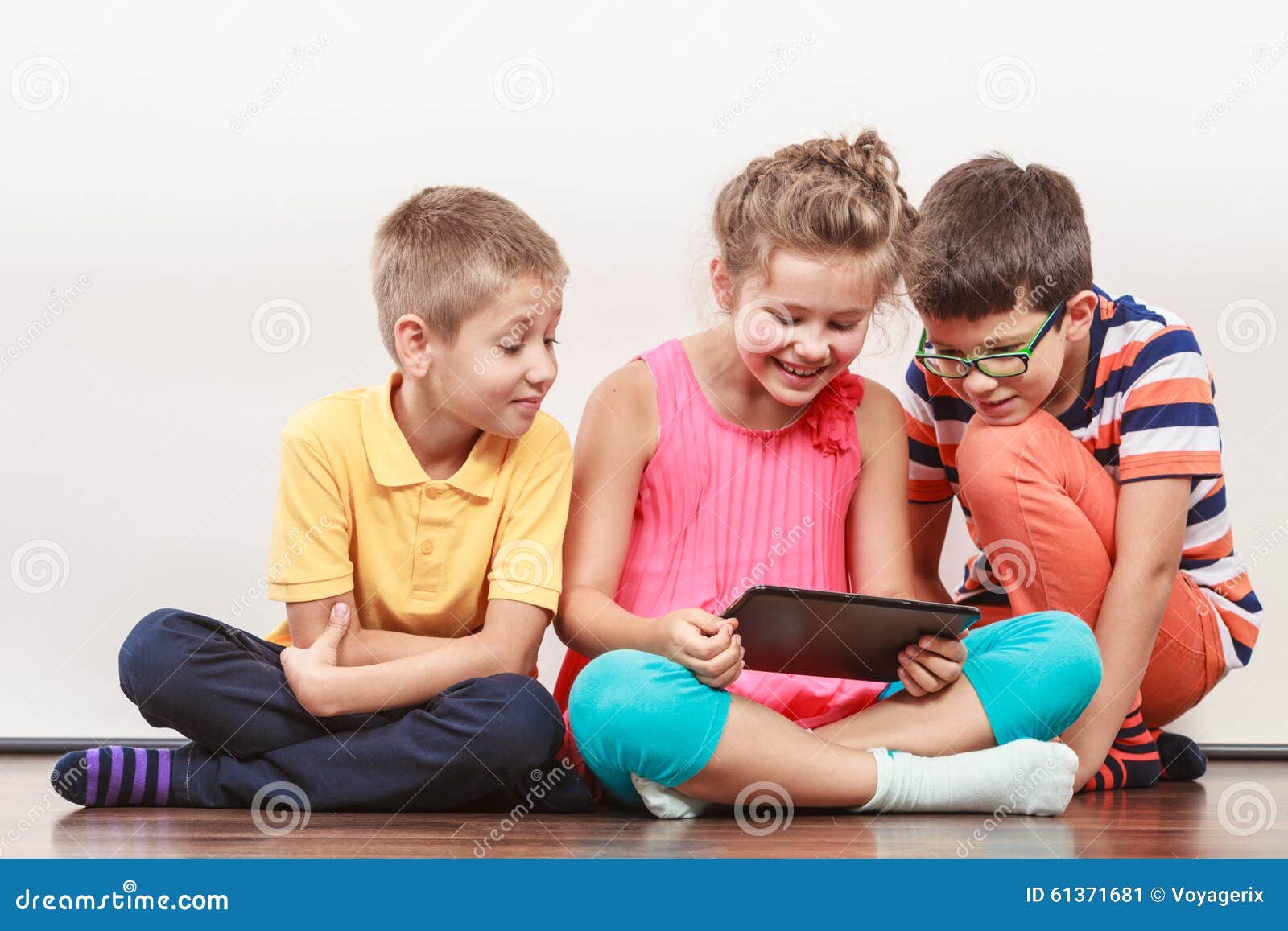 Kids playing on tablet. stock image. Image of family - 61371681
