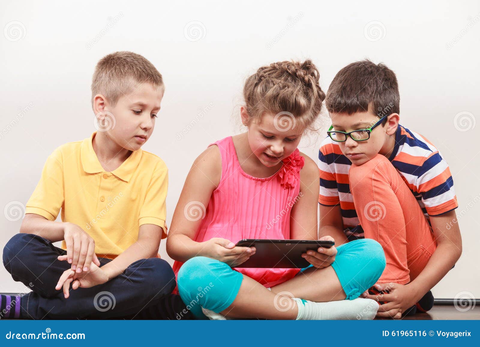 Kids playing on tablet. stock photo. Image of girl, room - 61965116