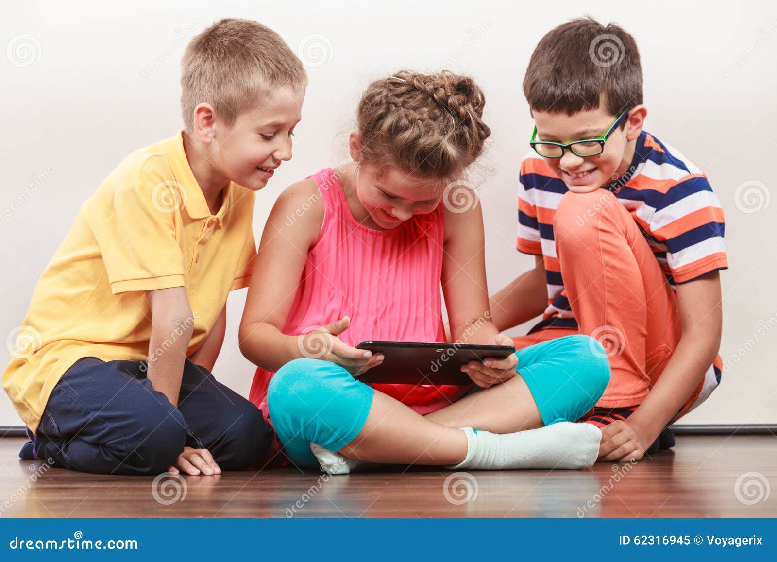 Kids playing on tablet. stock image. Image of room, connection - 62316945