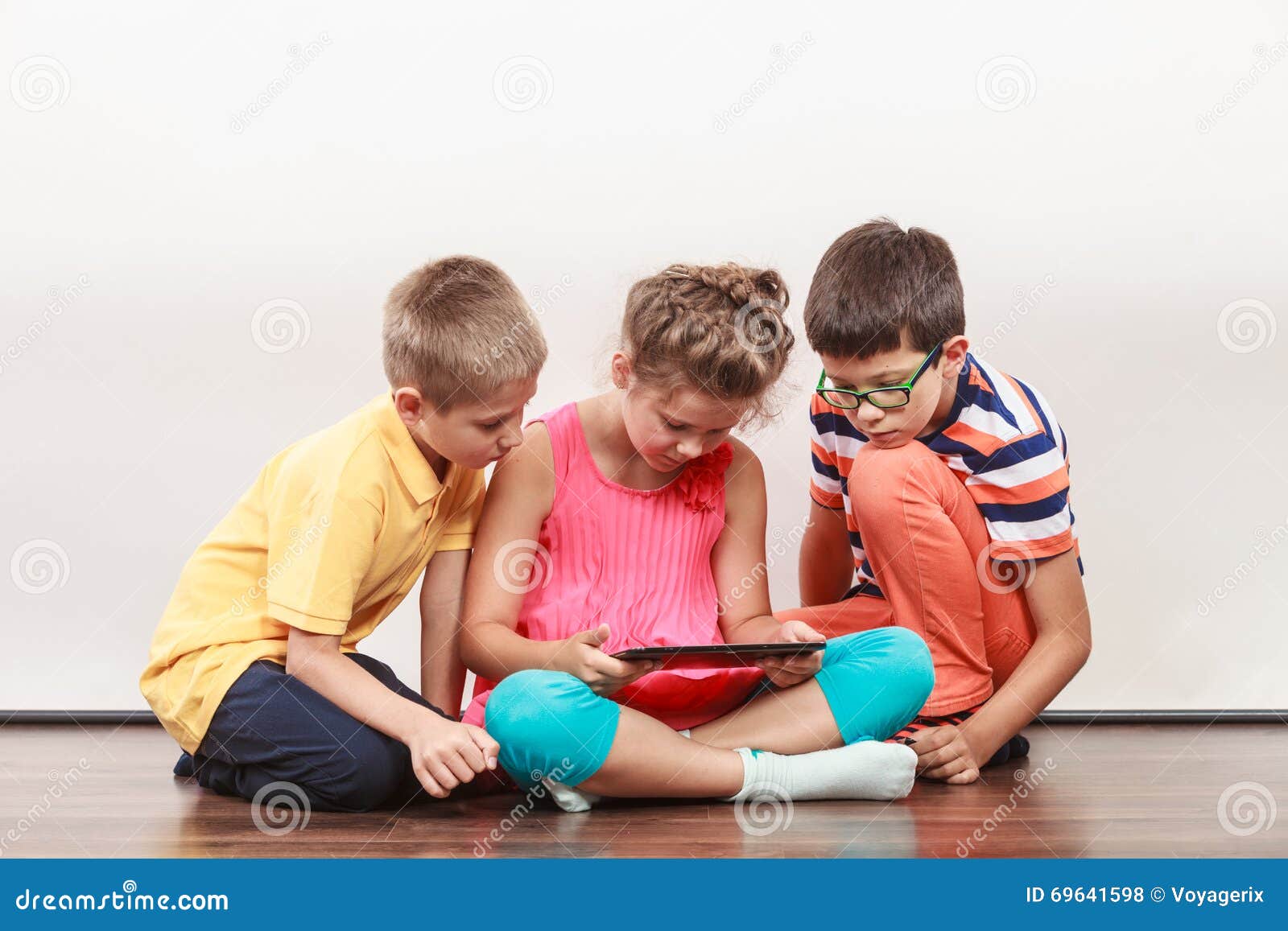 Kids playing on tablet. stock photo. Image of playing - 69641598