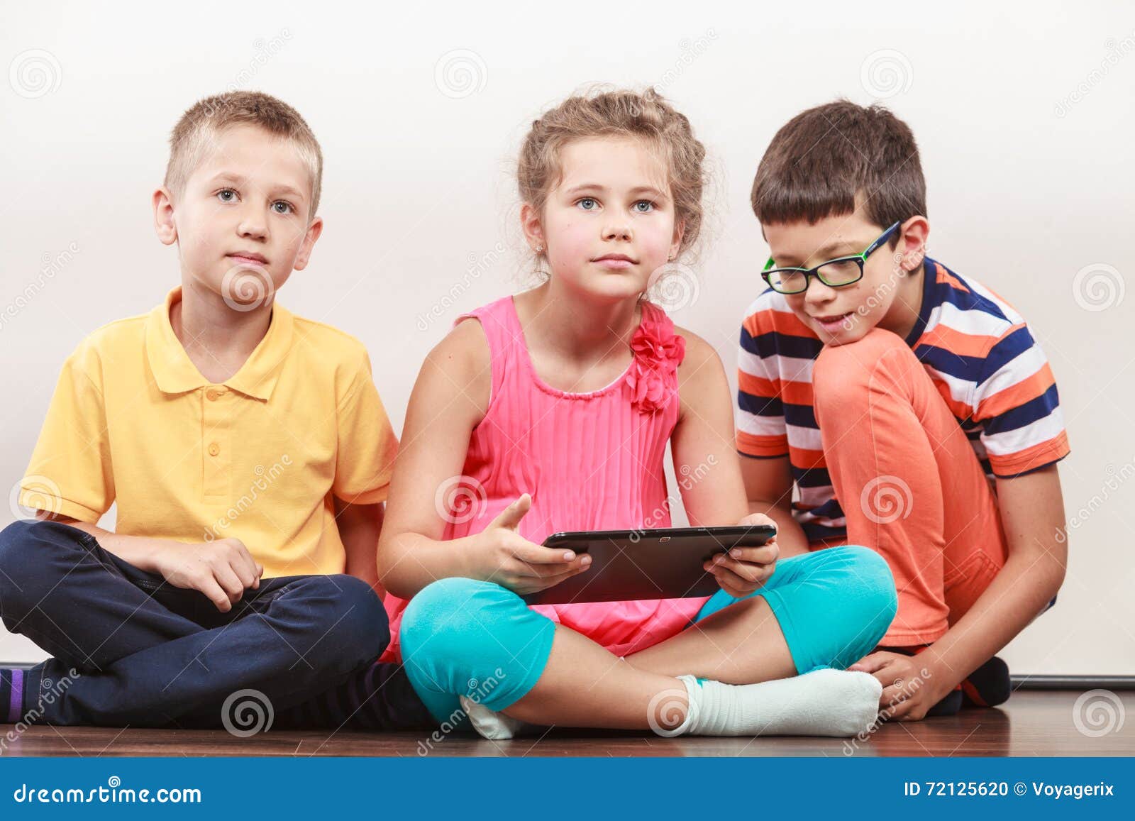 Kids playing on tablet. stock photo. Image of playing - 72125620