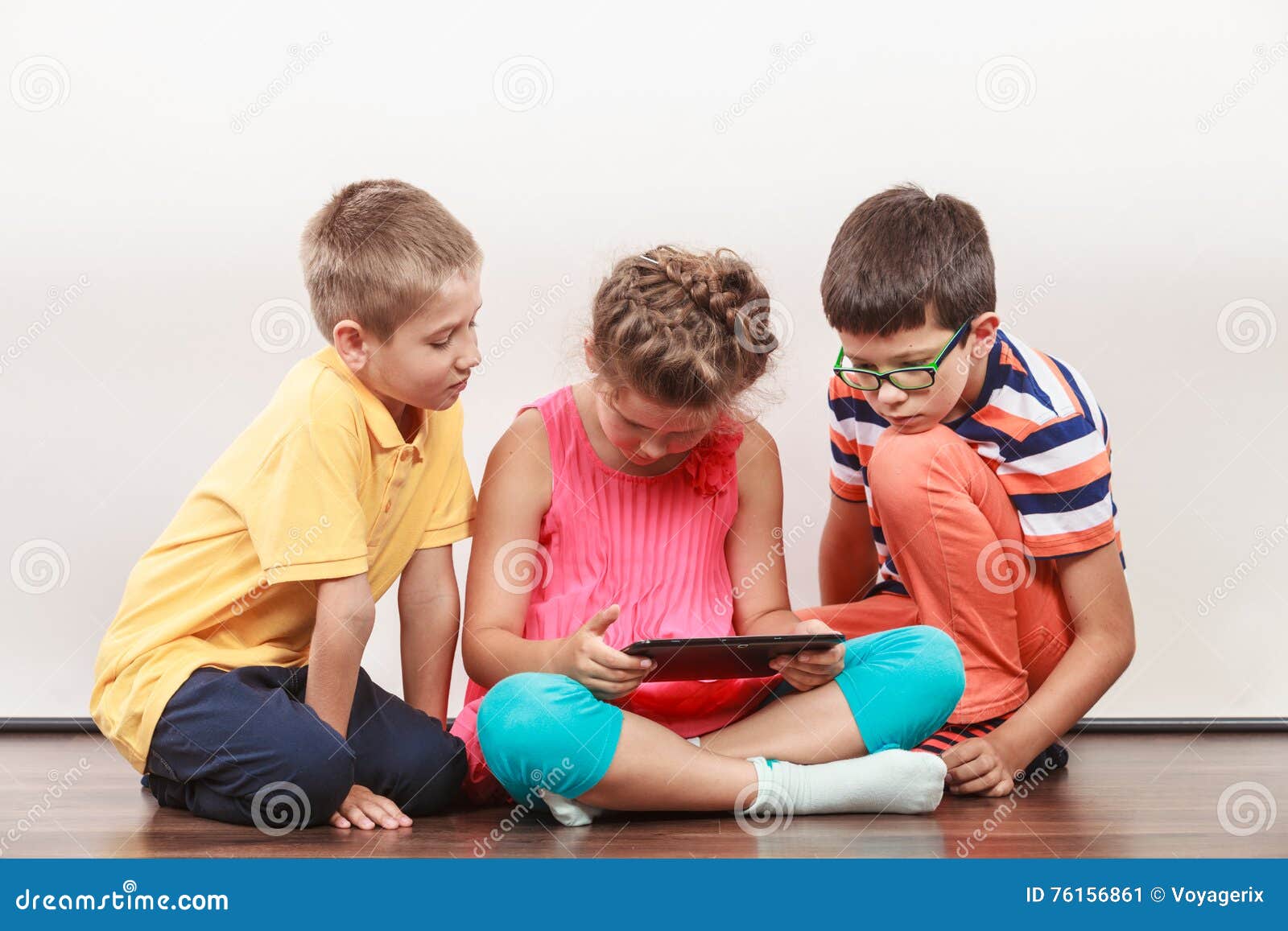 Kids playing on tablet. stock image. Image of group, girl - 76156861