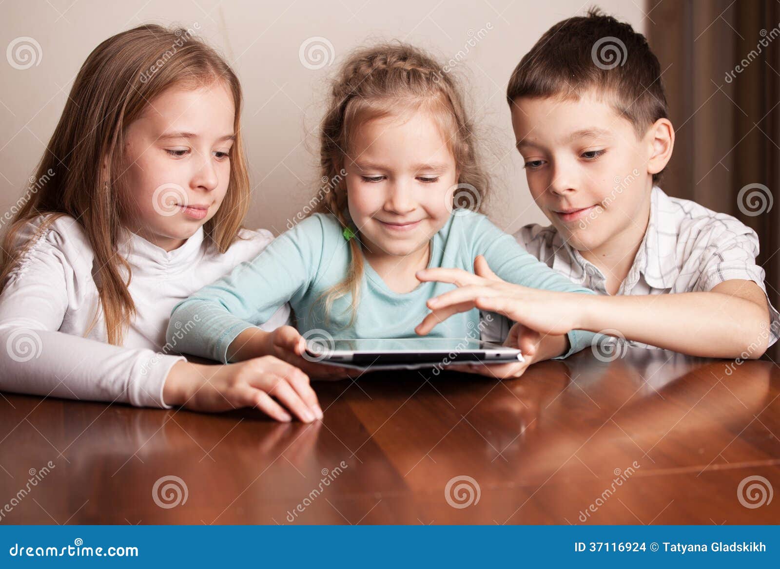 Kids playing on tablet pc stock photo. Image of family - 37116924