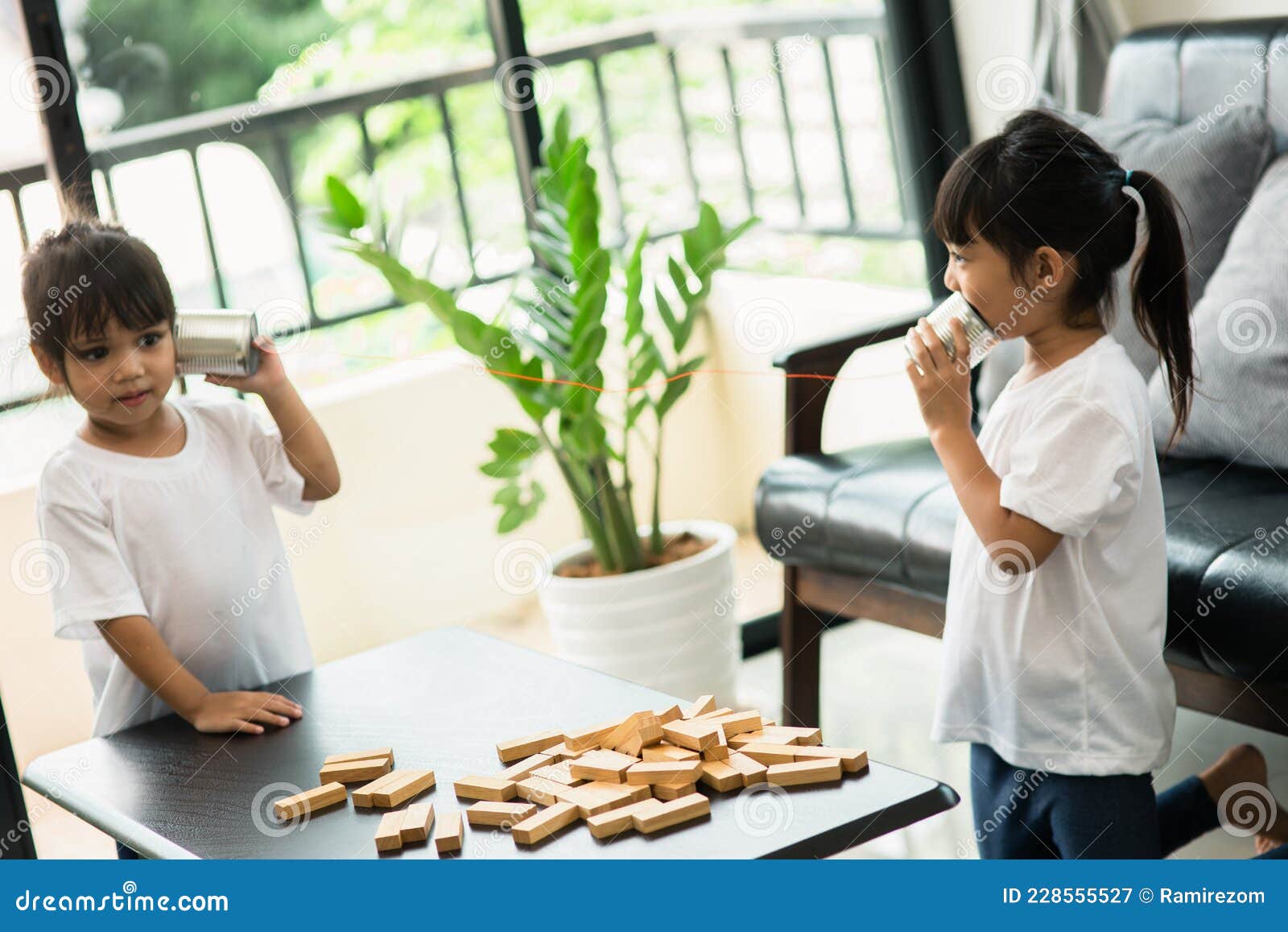 Kids Playing with Tin Can and String Phone As Communication Concept ...