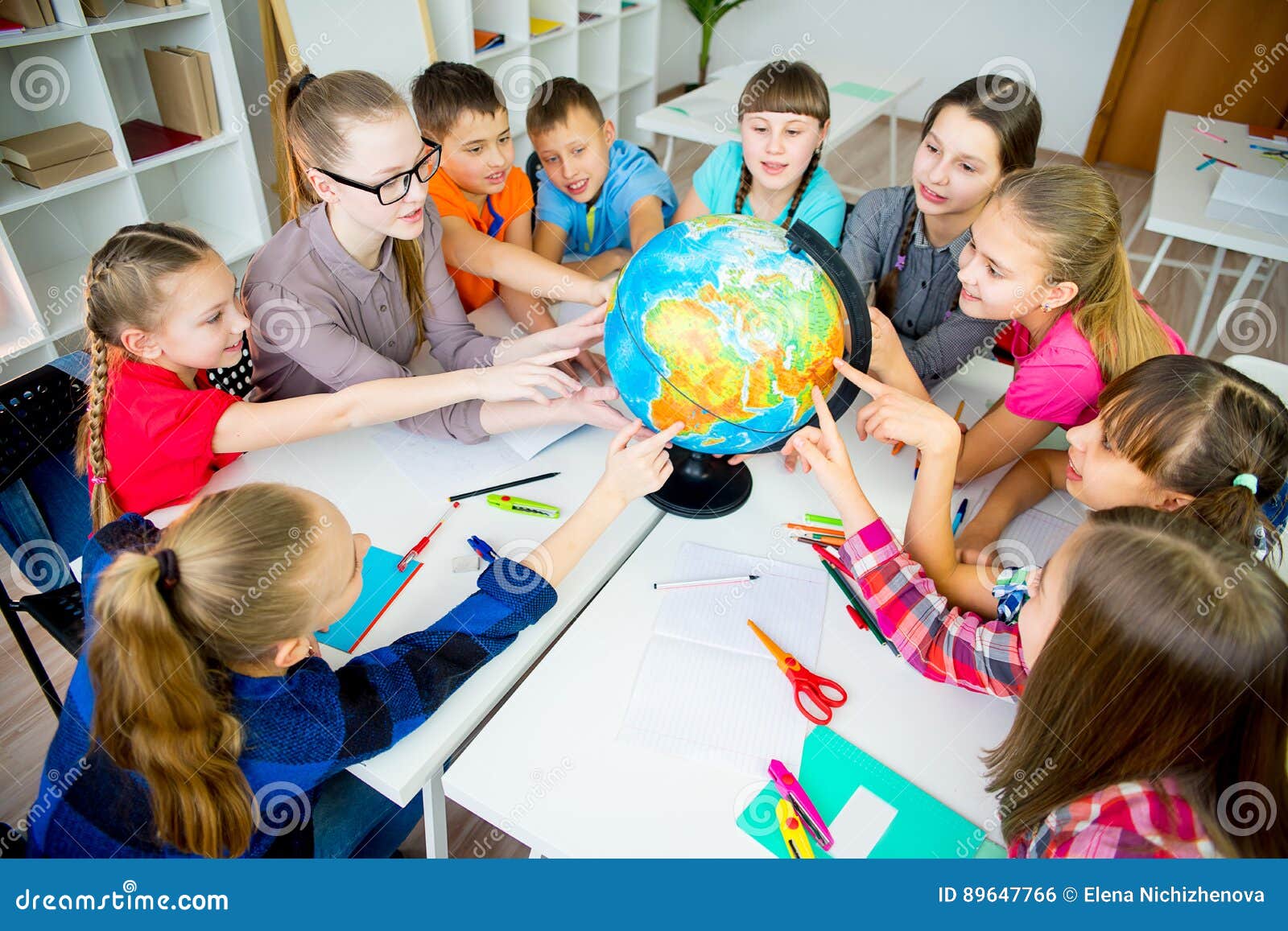 Kids pointing at globe stock photo. Image of young, white - 89647766