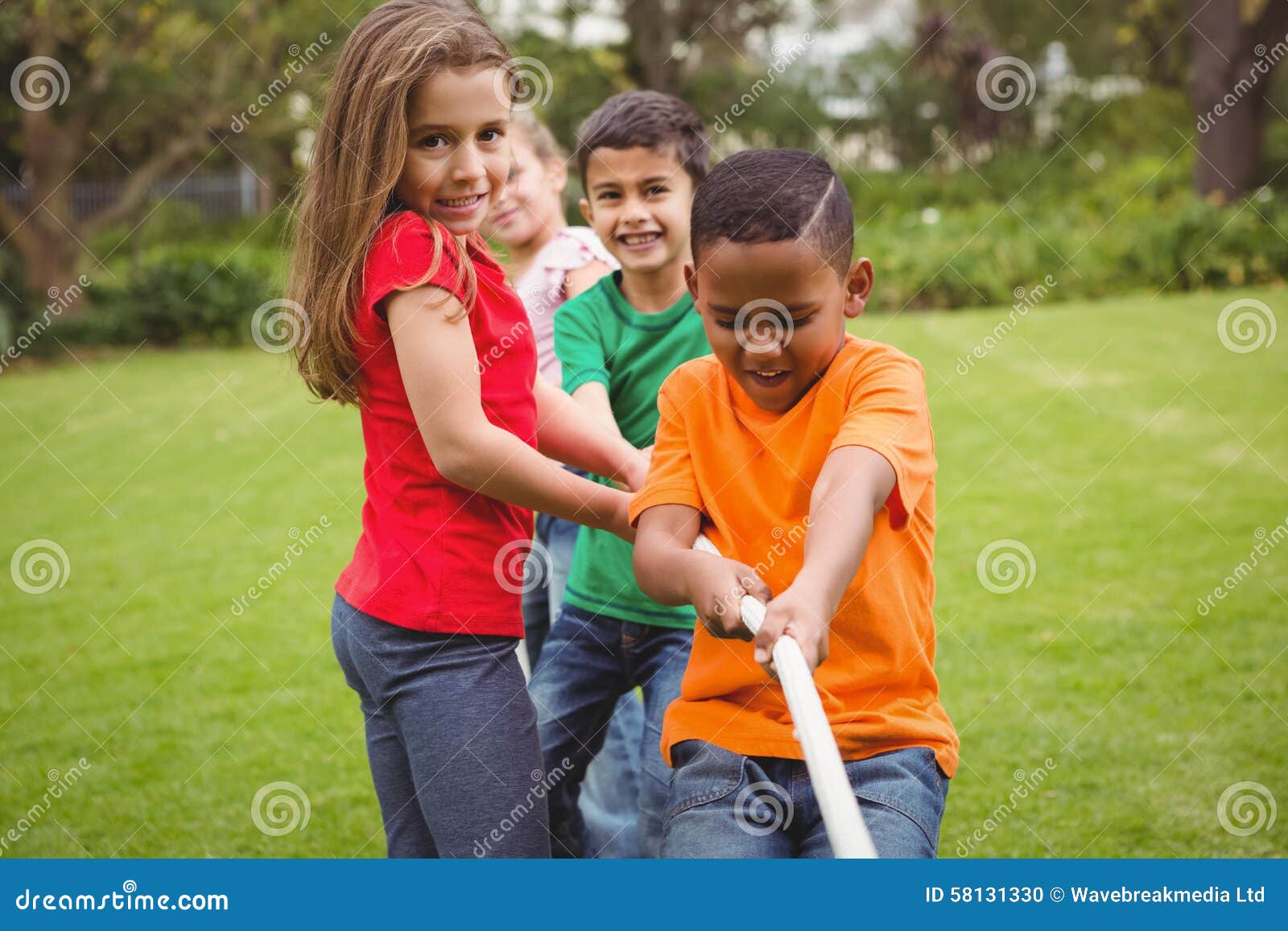 Kids pulling a large rope stock photo. Image of female - 58131330