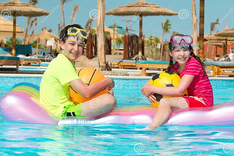 Kids on raft in pool stock image. Image of water, kids - 20340645