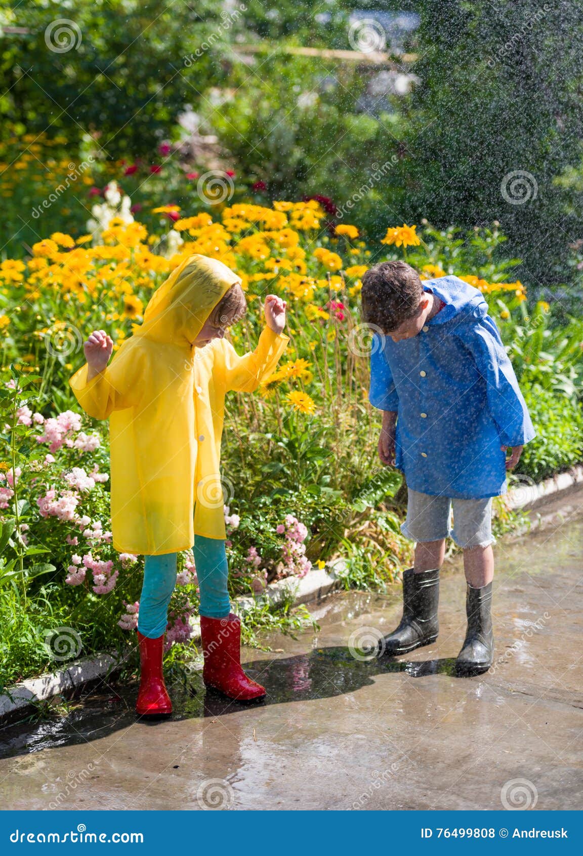 Kids in rain stock photo. Image of waterproof, backyard - 76499808