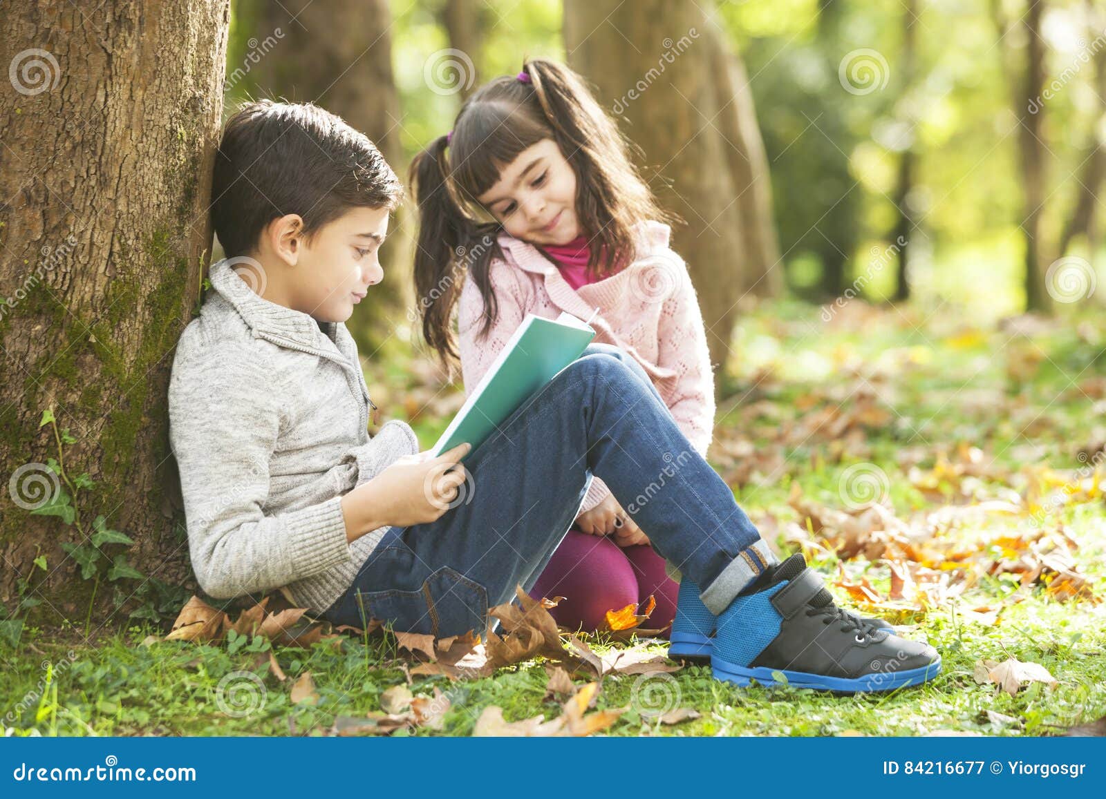 Kids Reading a Book Outdoors Stock Image - Image of fantasy, leisure ...