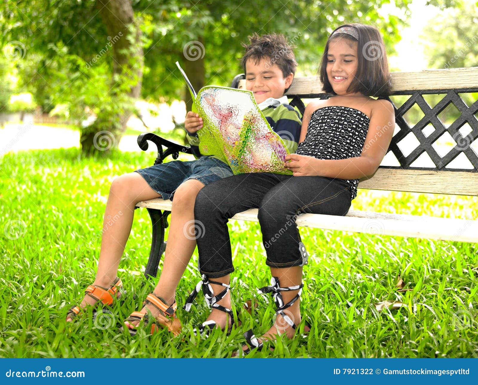 Kids Reading a Book in a Park Stock Photo - Image of hearts, children ...
