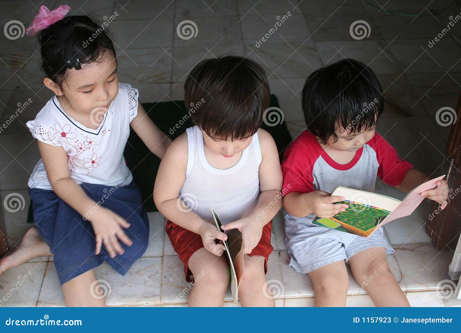 Kids reading books stock image. Image of joyful, girls - 1157923