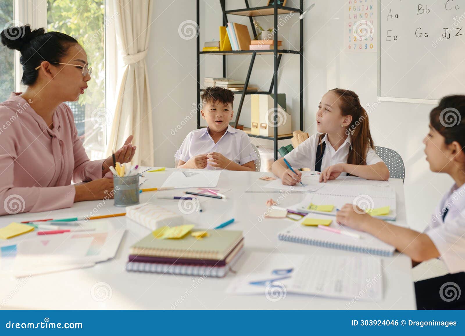 Kids Practicing Letter Pronunciation Stock Photo - Image of study ...