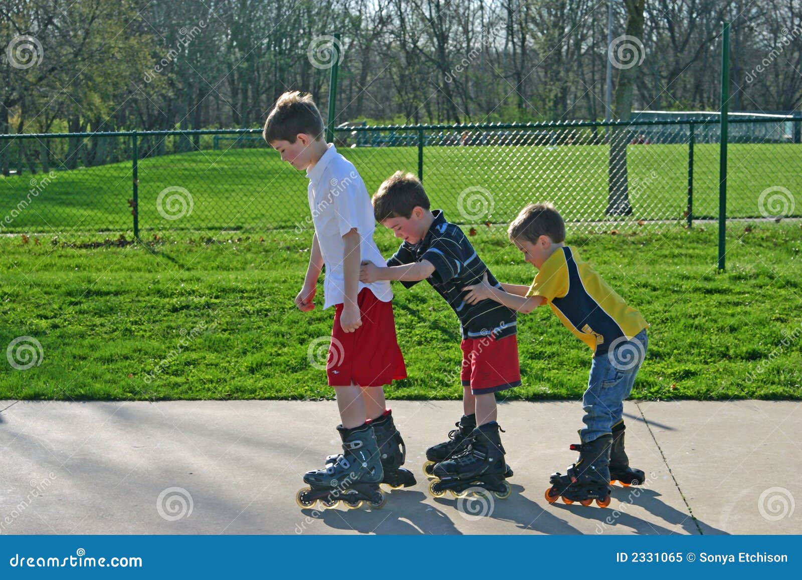 Kids Roller-Blading stock image. Image of childhood, grin - 2331065