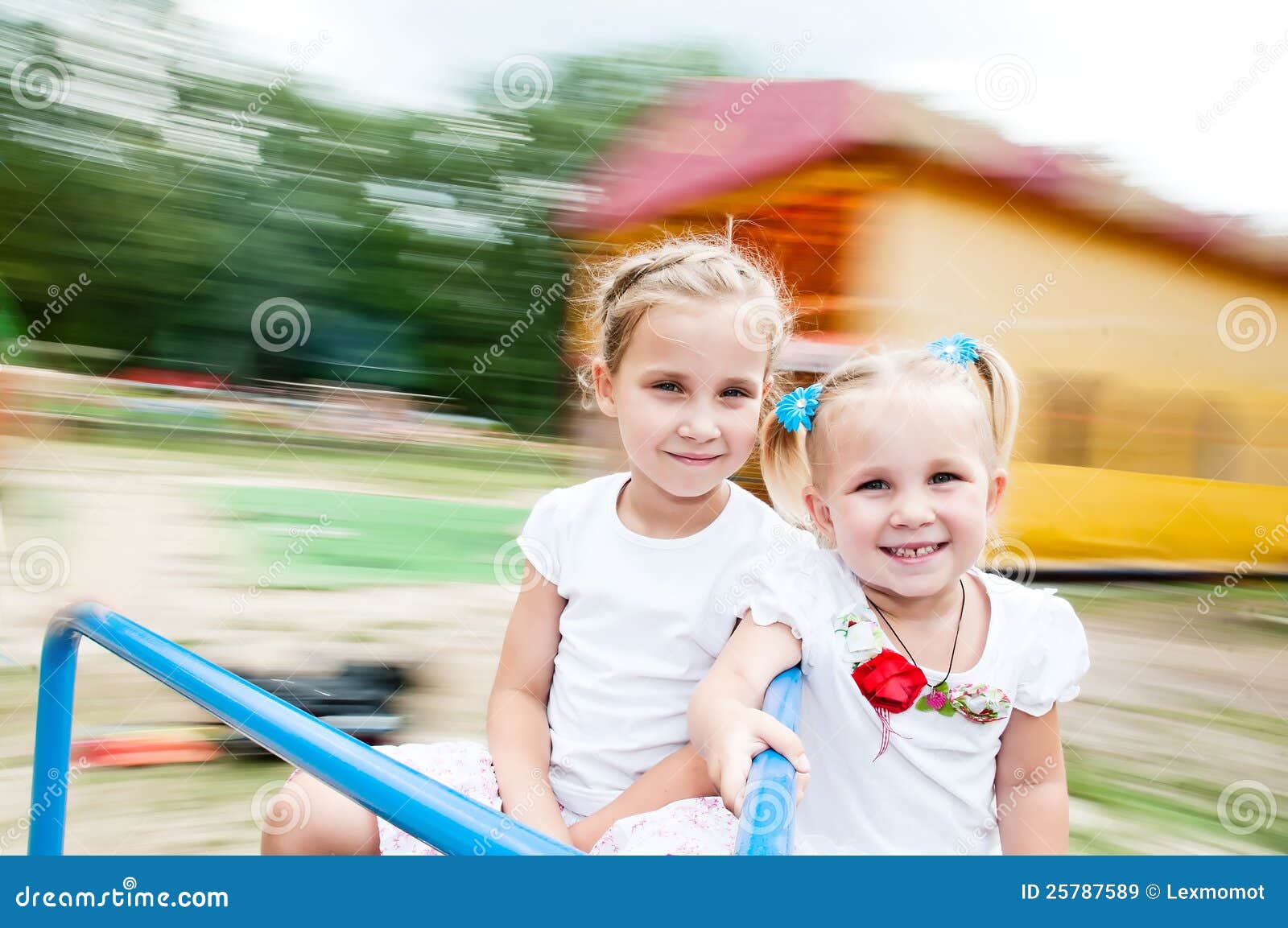 Kids rotate on a carousel stock image. Image of ecstatic - 25787589