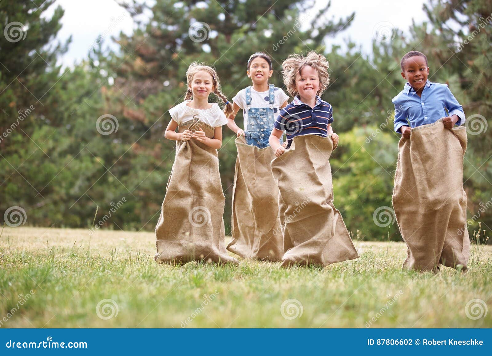 Kids at sack race stock photo. Image of diversity, leisure - 87806602